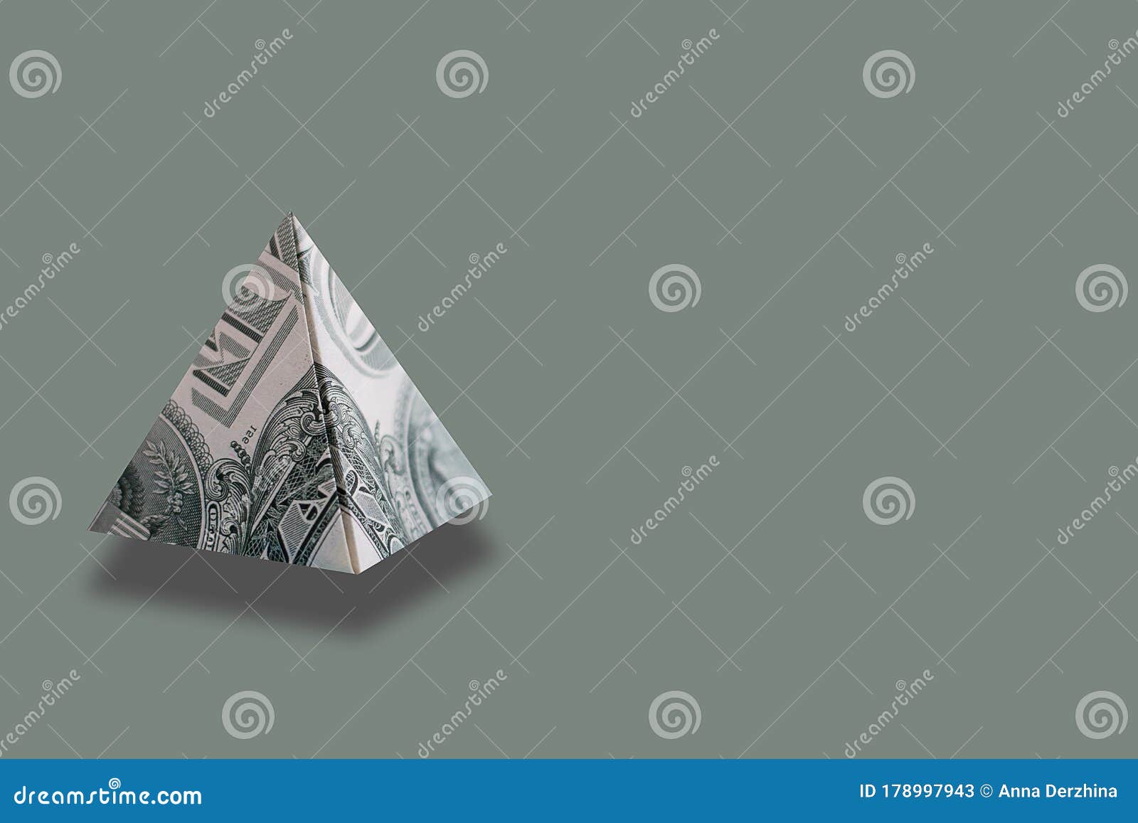 Money Pyramid on Green Background. Copy Space. Stock Image - Image of ...