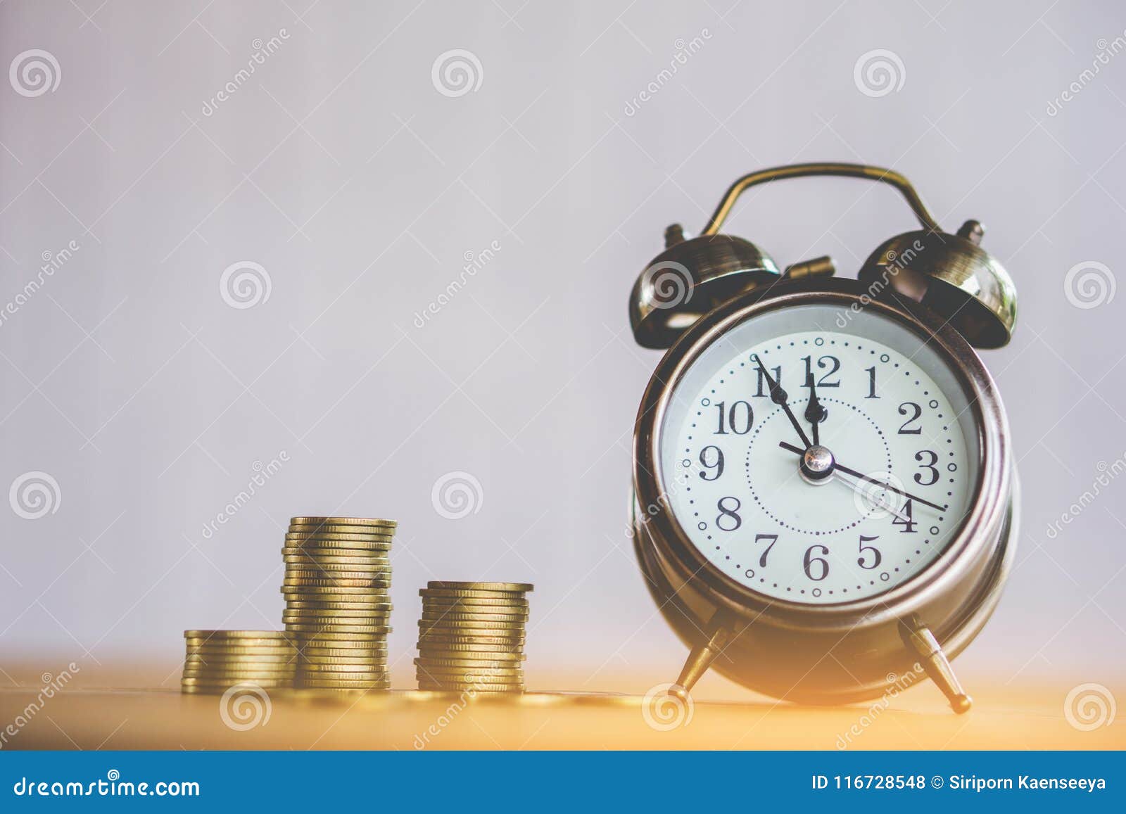 Money and Time Concept with Stack of Coin and Clock on Table Stock ...