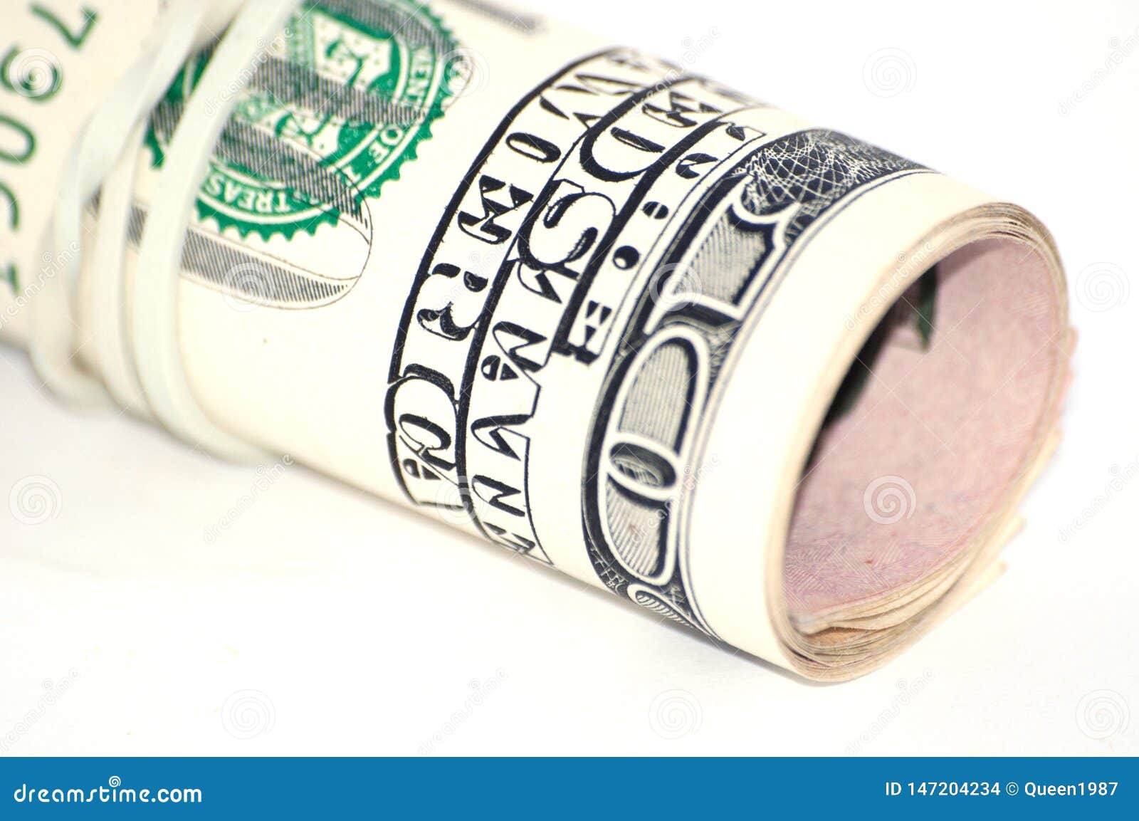 Money on White Background Close Up of Dollars Rolled Up Stock Photo ...
