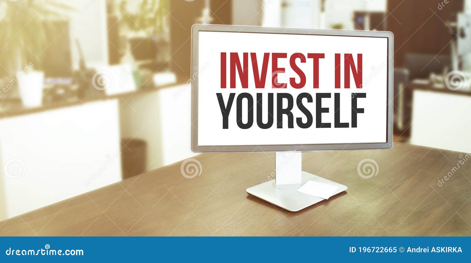 Monitor in Modern Office with INVEST in YOURSELF Text on the Screen ...