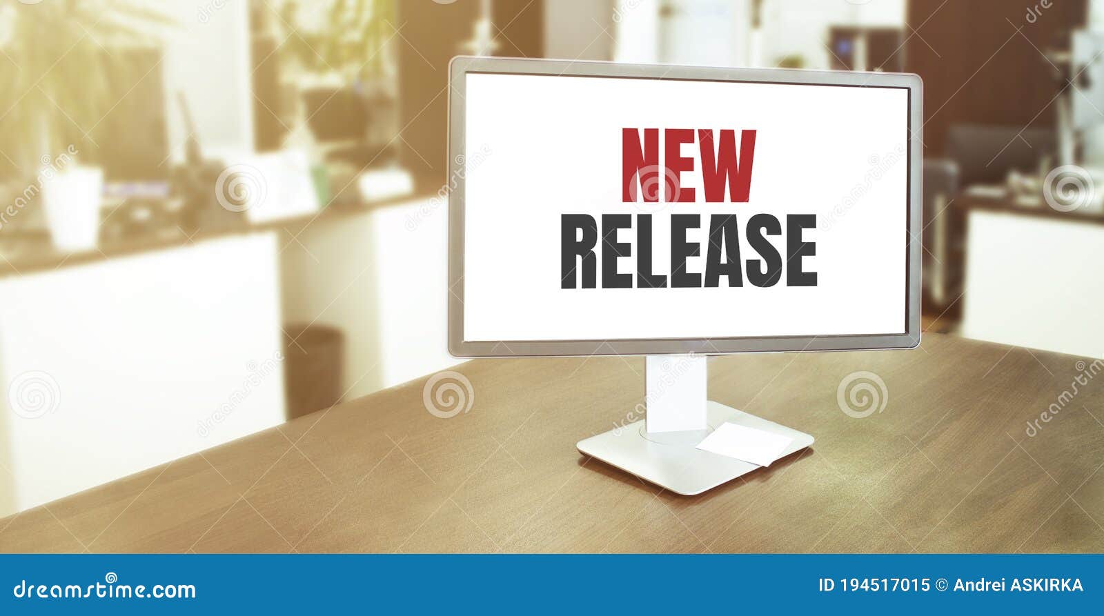Monitor in Modern Office with NEW RELEASE Text on the Screen Stock ...