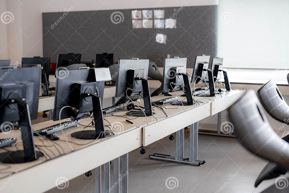 Monitors and Keyboard in an Empty Computer Lab at a Secondary School Stock Photo - Image of ...
