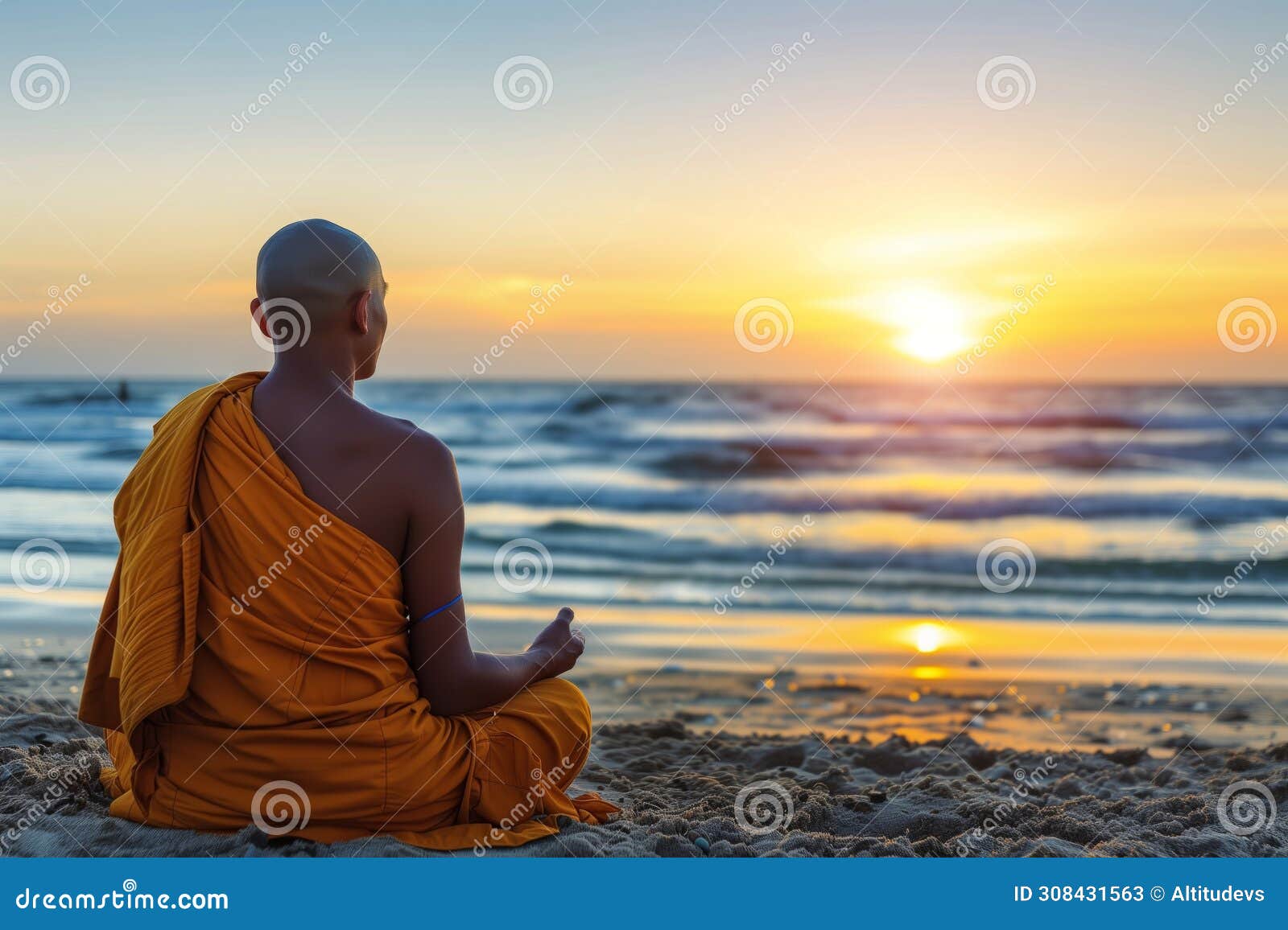 Monk Sitting Crosslegged on a Beach at Sunset, Facing the Sea Stock ...