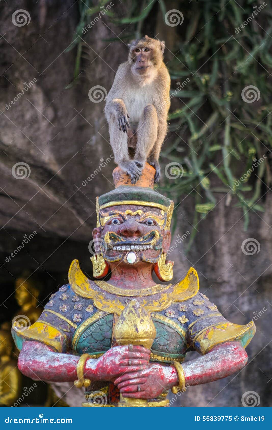 Monkey seats on the statue stock image. Image of fauna - 55839775