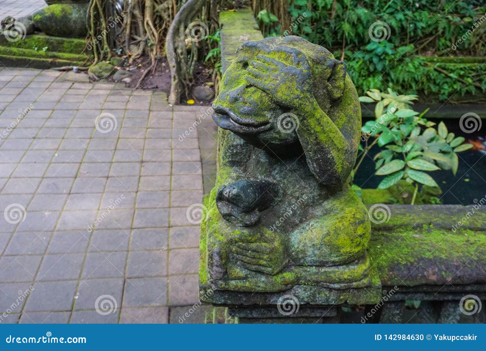Monkey Statue in Bali Covered with Moss Stock Photo - Image of ...