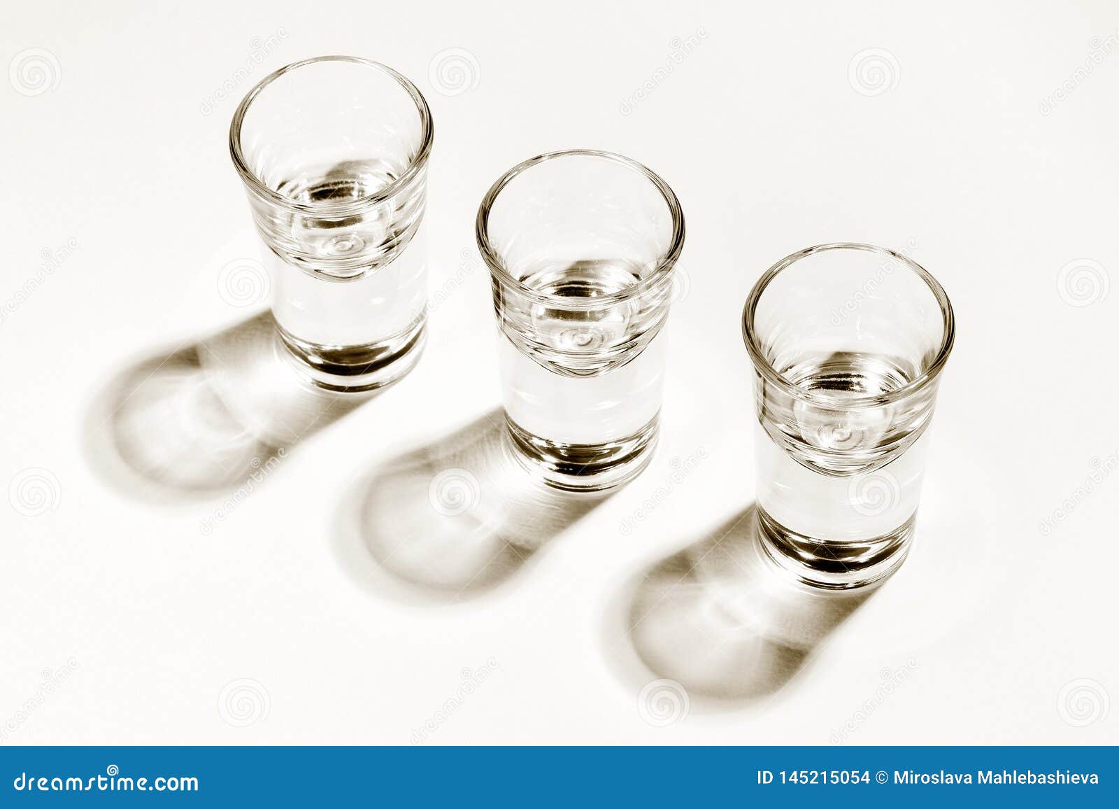 Monochromatic Image of Three Empty Shot Glasses, Harsh Side Lighted ...