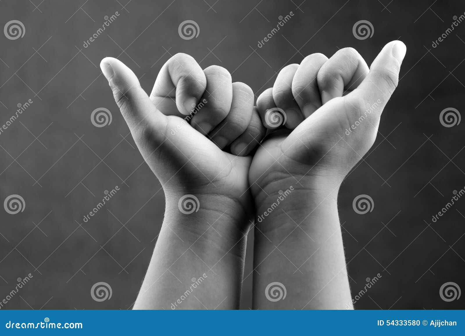 Monochrome Image of Closed Hands of a Kid for Concepts of Strength and ...