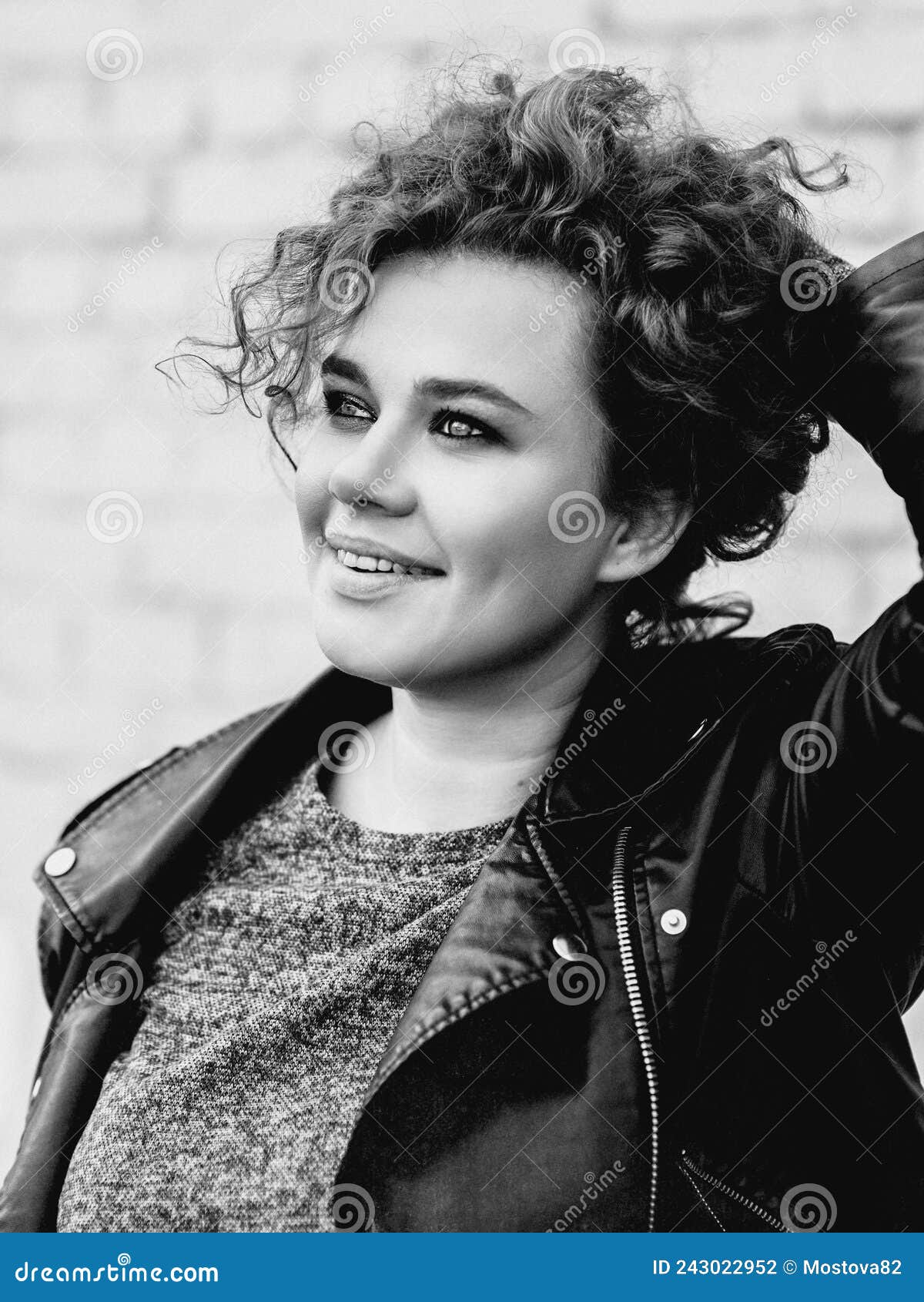 Monochrome Portrait Of Young Beautiful Cheerful Woman With Curly Hair