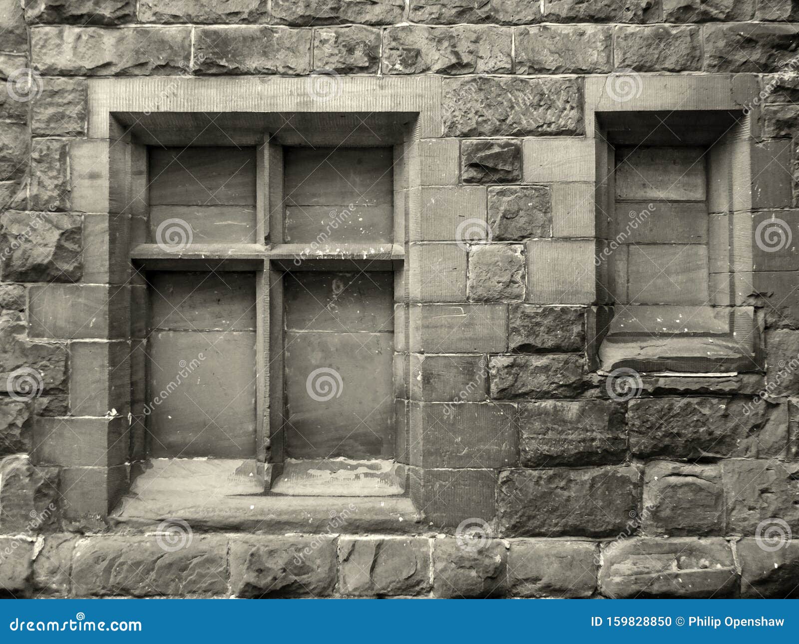 Monochrome Sepia Image Of Ancient Blocked Up Stone Window Frames In A ...