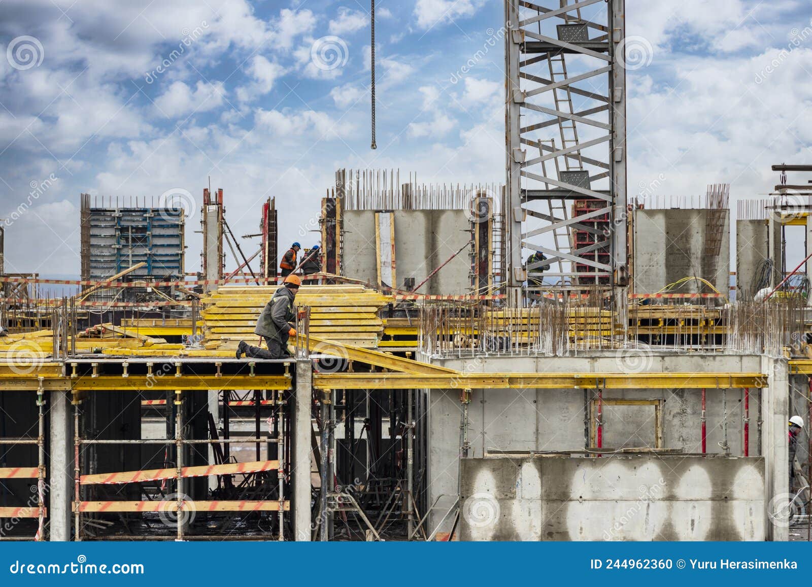 Monolithic Frame Construction of the Building. Workers Working at the ...