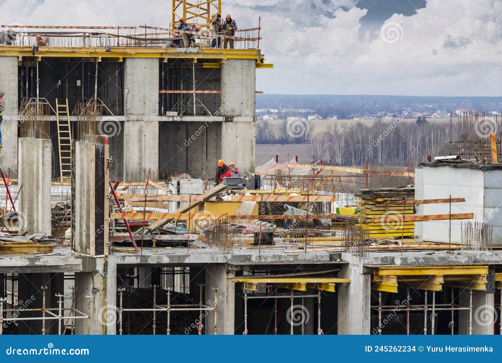 Monolithic Frame Construction of the Building. Workers Working at the ...