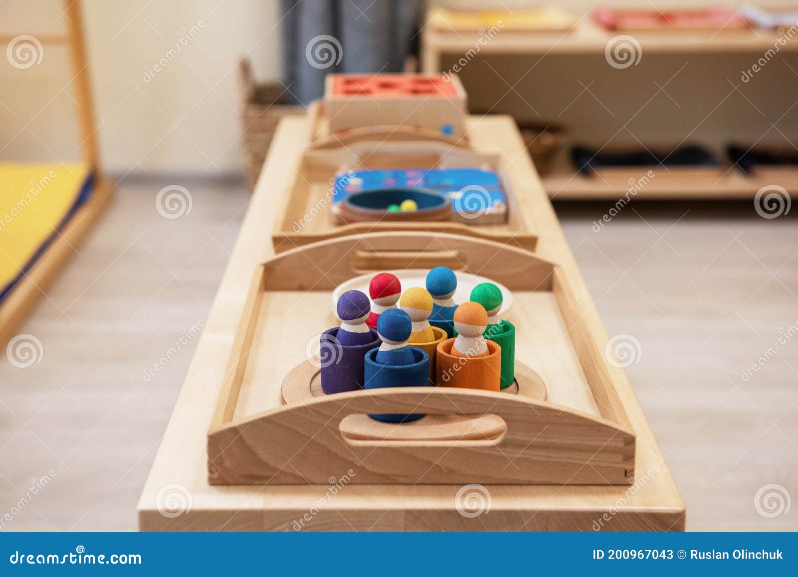 Montessori Wood Rainbow Material. A Child Plays With A Toy With His ...