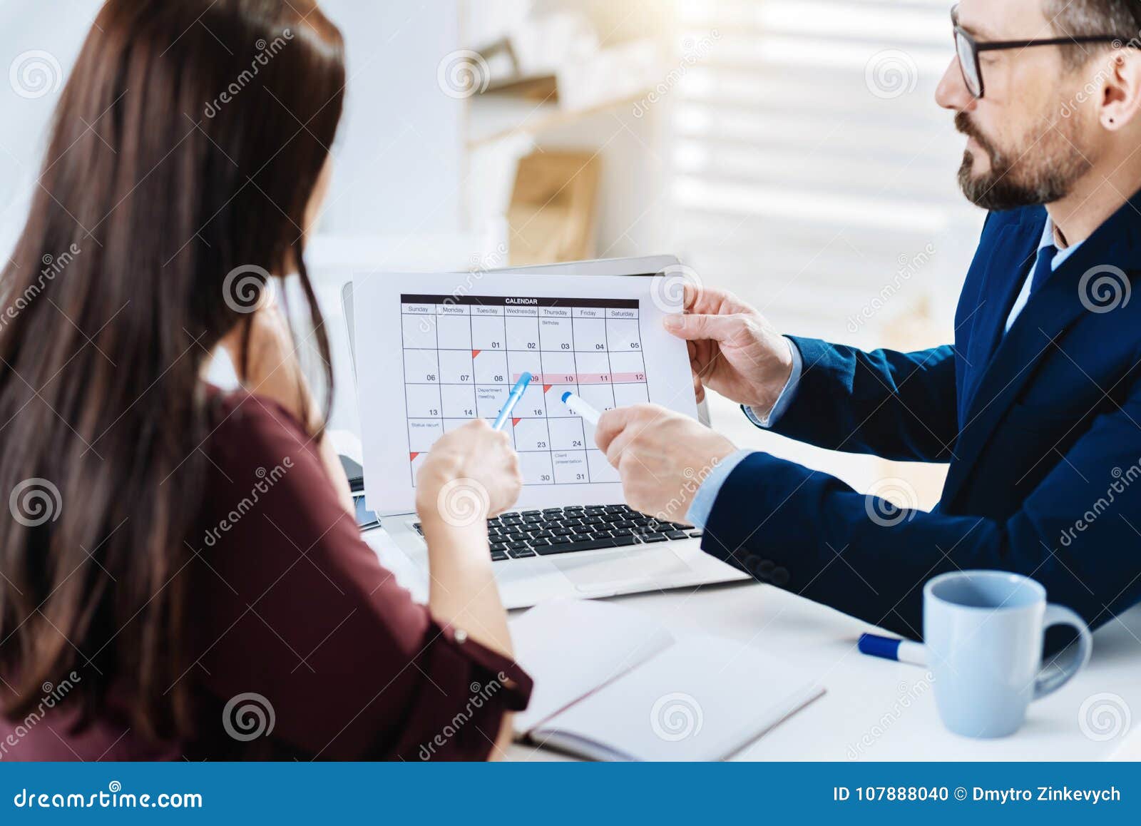 Young Two Colleagues Talking about Agenda Stock Photo - Image of ...