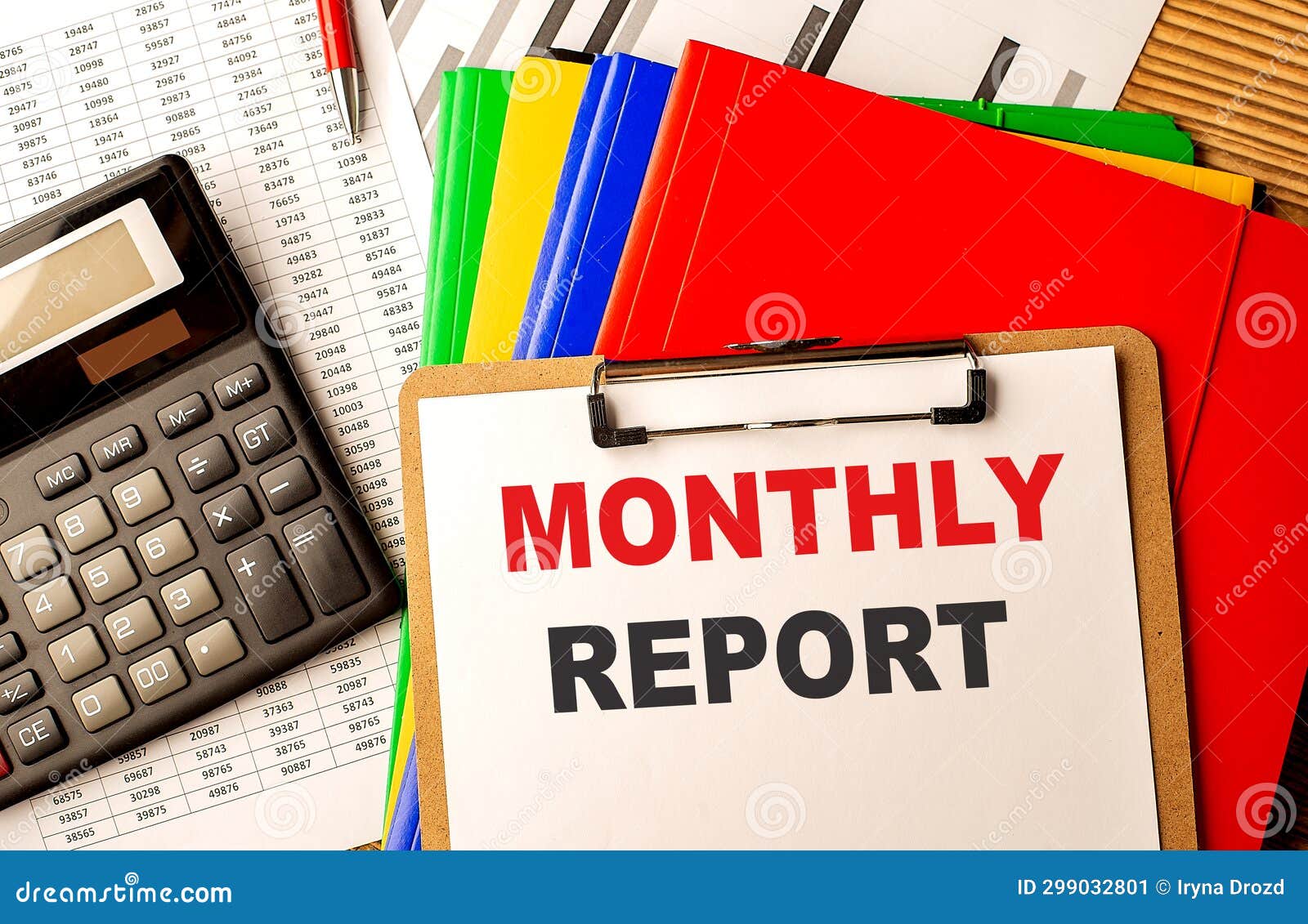 MONTHLY REPORT Text Written on Paper Clipboard with Chart and ...