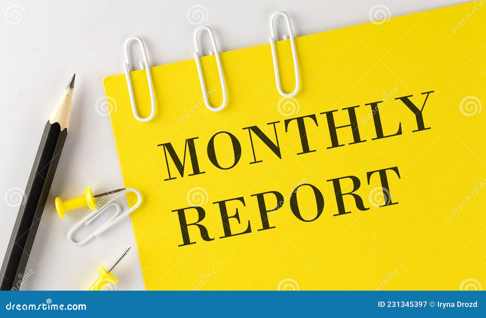 MONTHLY REPORT Word on the Yellow Paper with Office Tools on White ...