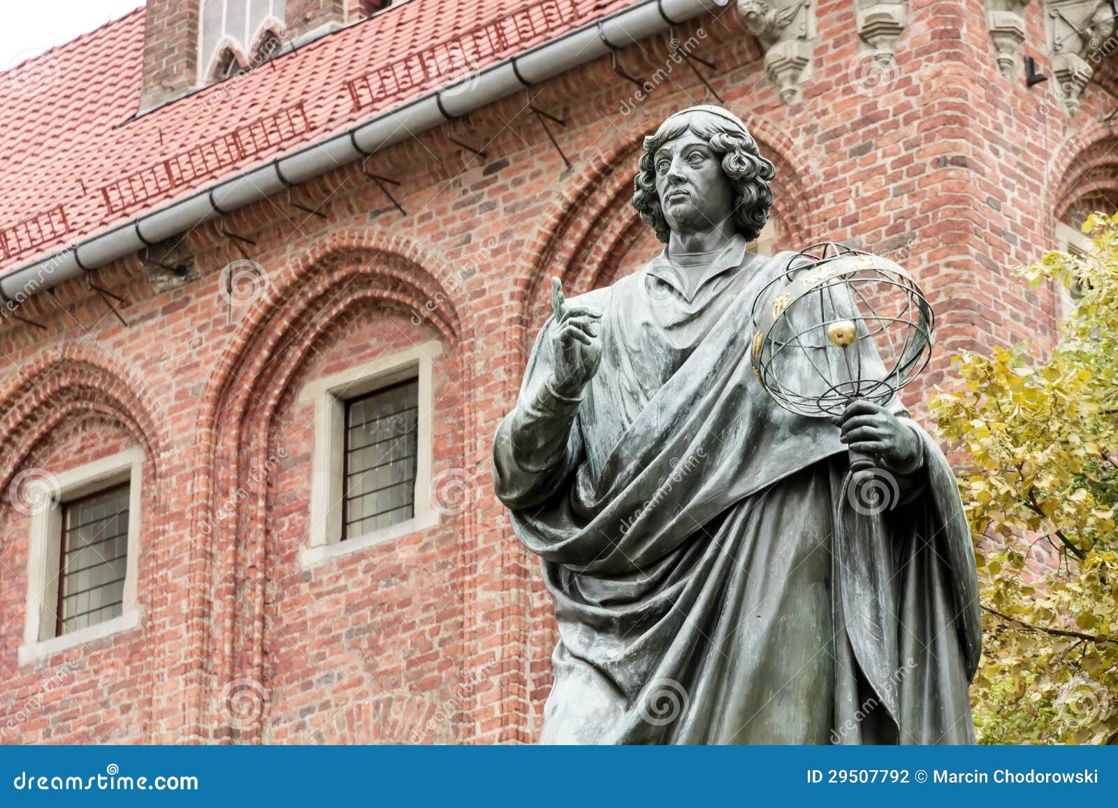 Monument of Copernicus Against Town Hall in Torun. Stock Photo - Image ...
