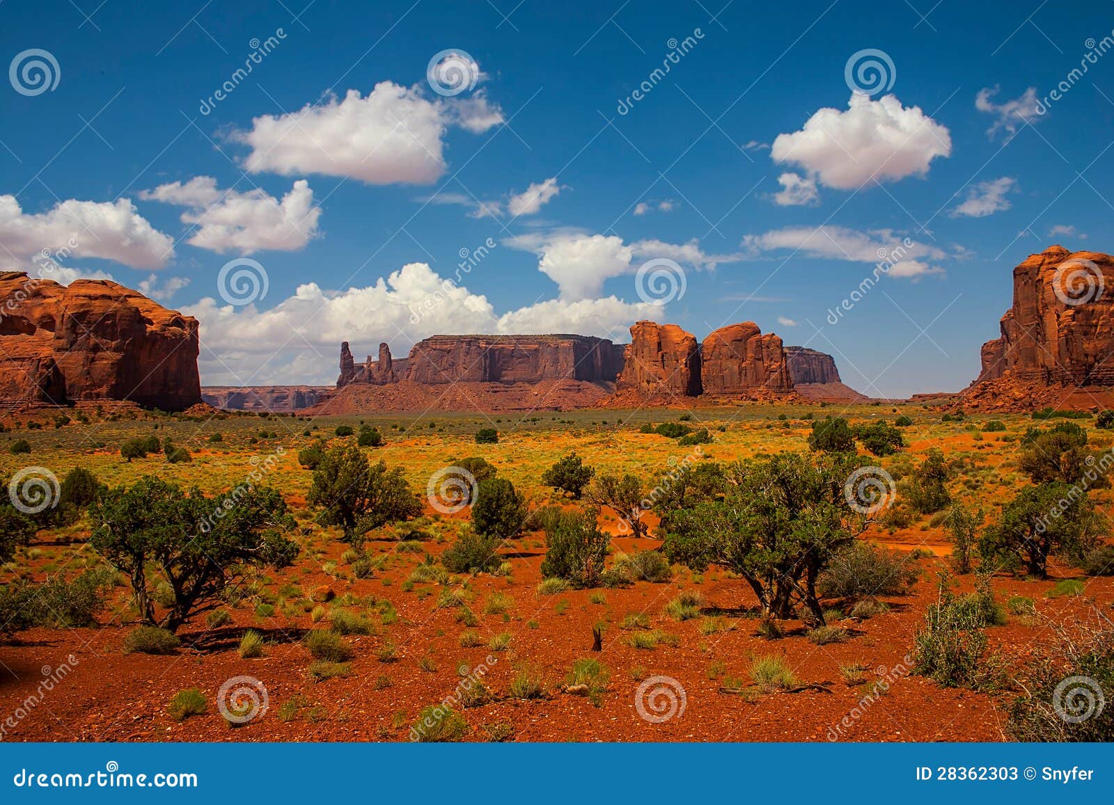 Monument Valley Landscape with Vegetation and Clouds in the Blue Stock ...