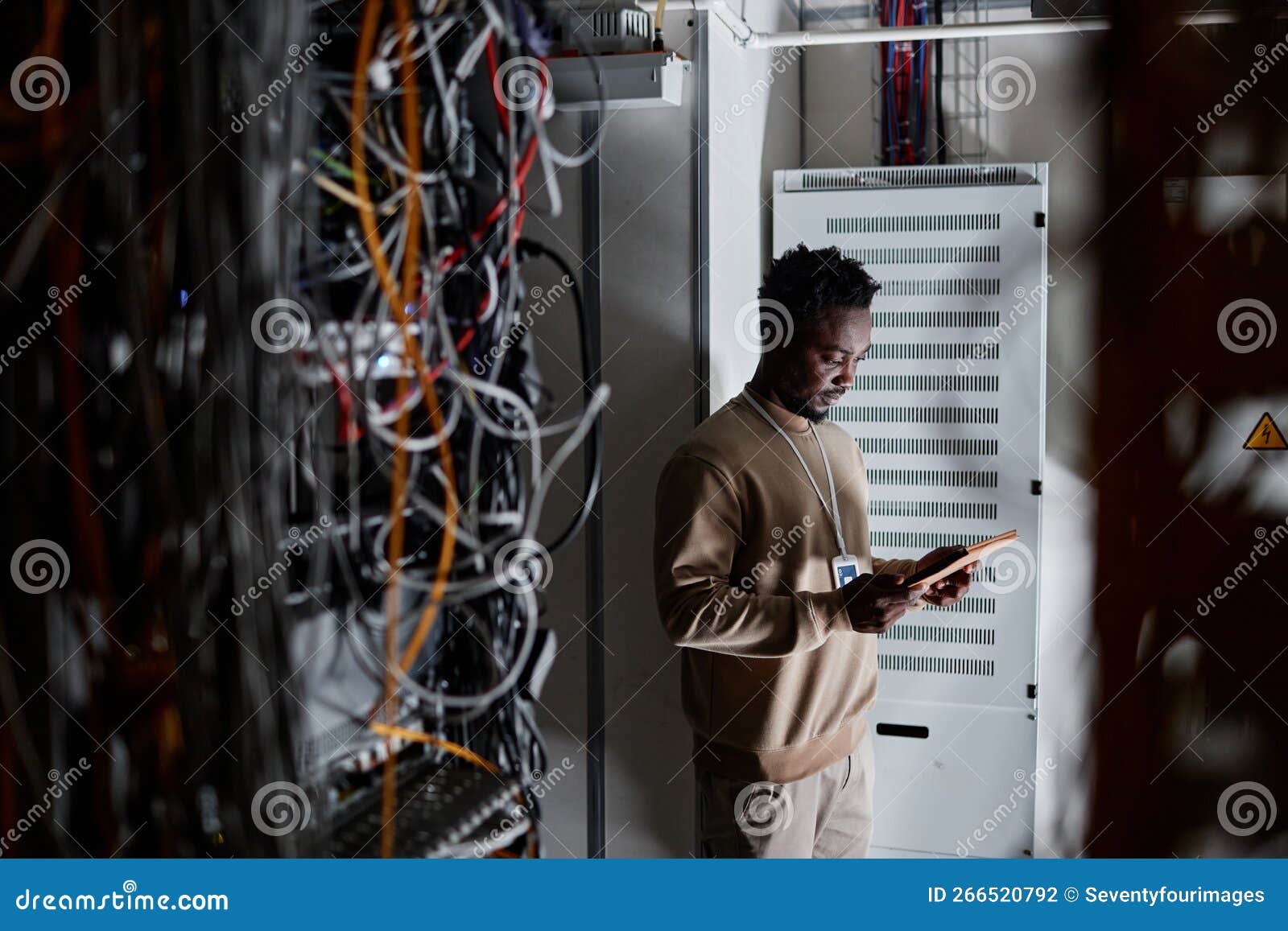 Moody Wide Angle Shot System Administrator Standing in Server Room ... Moody Wide Angle Shot System Administrator Standing in Server Room ...