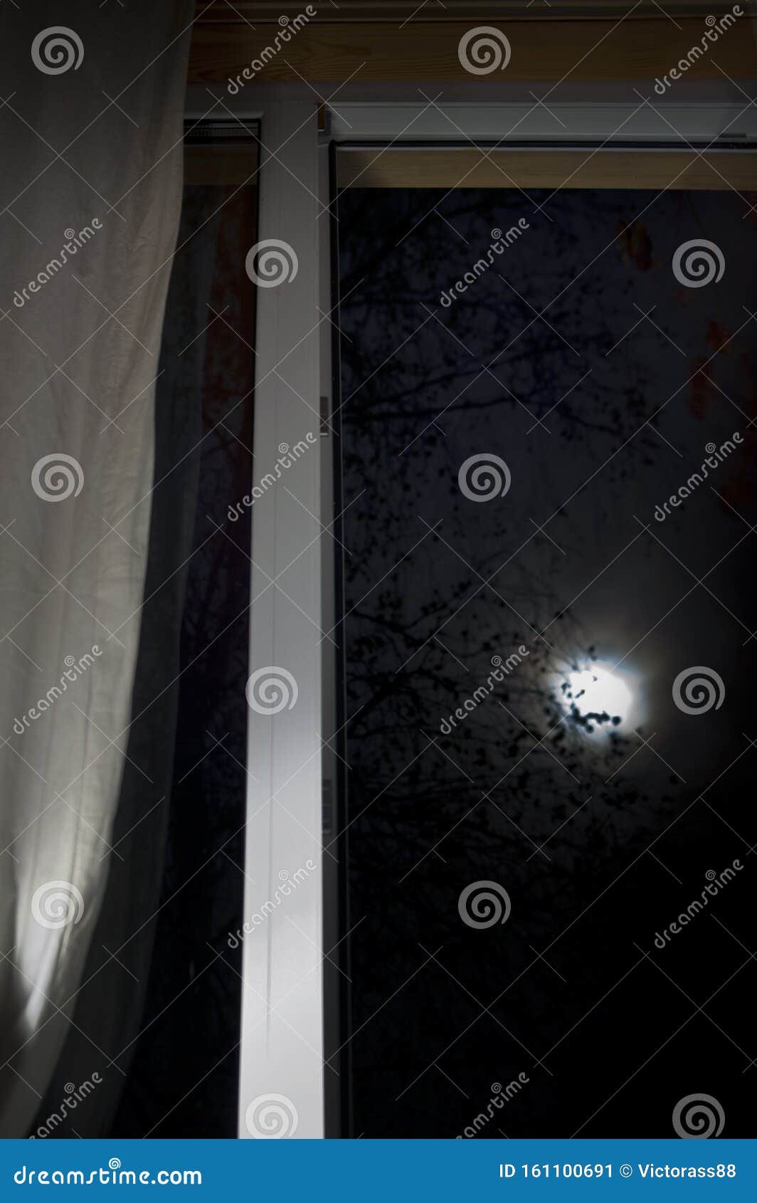 Moon behind a window stock image. Image of trees, dark - 161100691