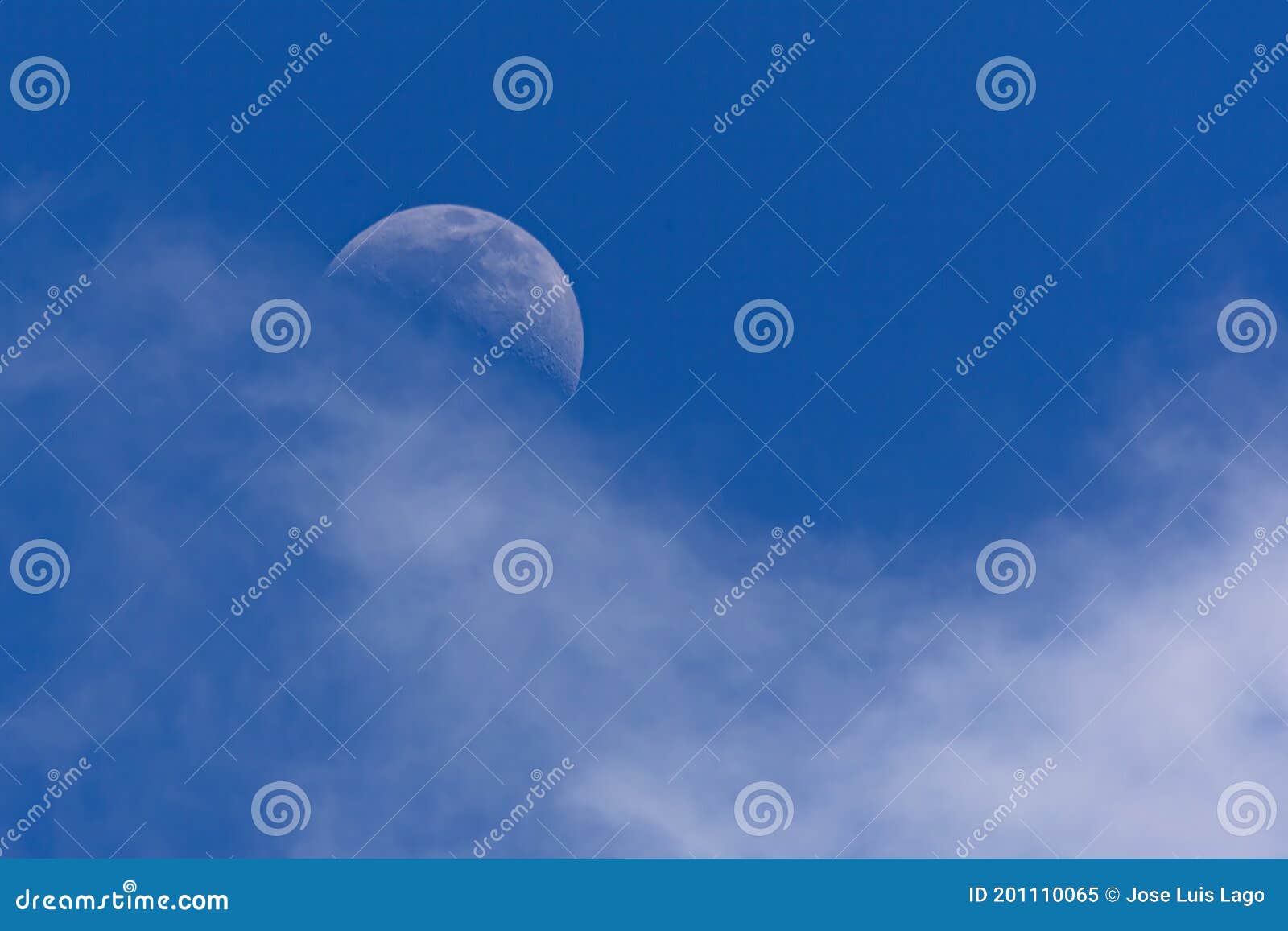 Moon in Broad Daylight, Half Hidden Behind a Cloud Stock Image - Image ...