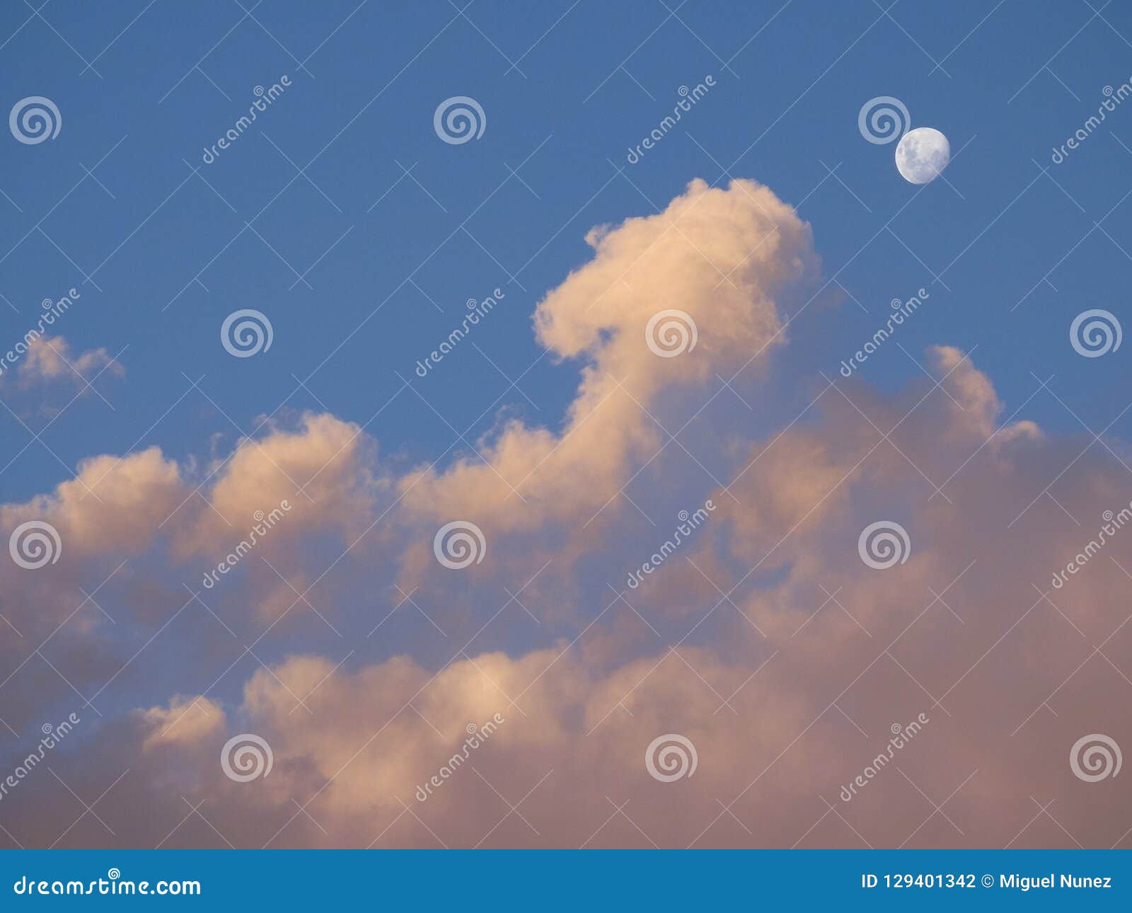 Moon with Clouds at Sunset stock photo. Image of dark - 129401342
