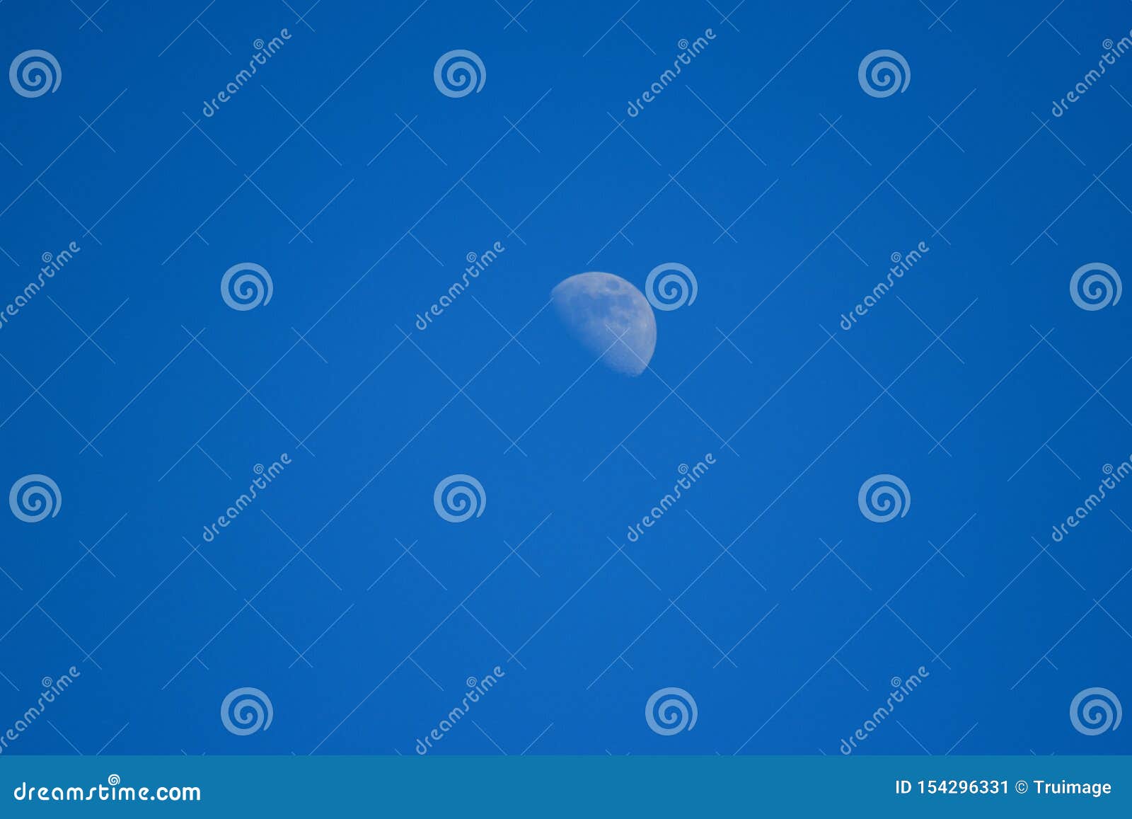 The moon in daylight sky stock image. Image of grey - 154296331