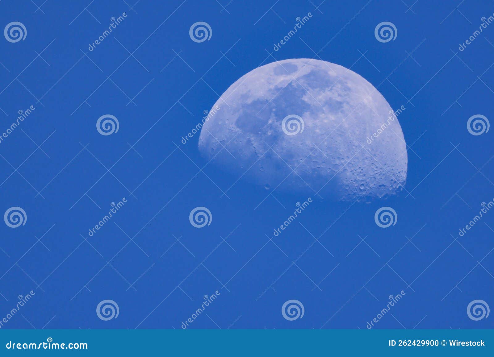 Moon fading in a blue sky stock photo. Image of beautiful - 262429900