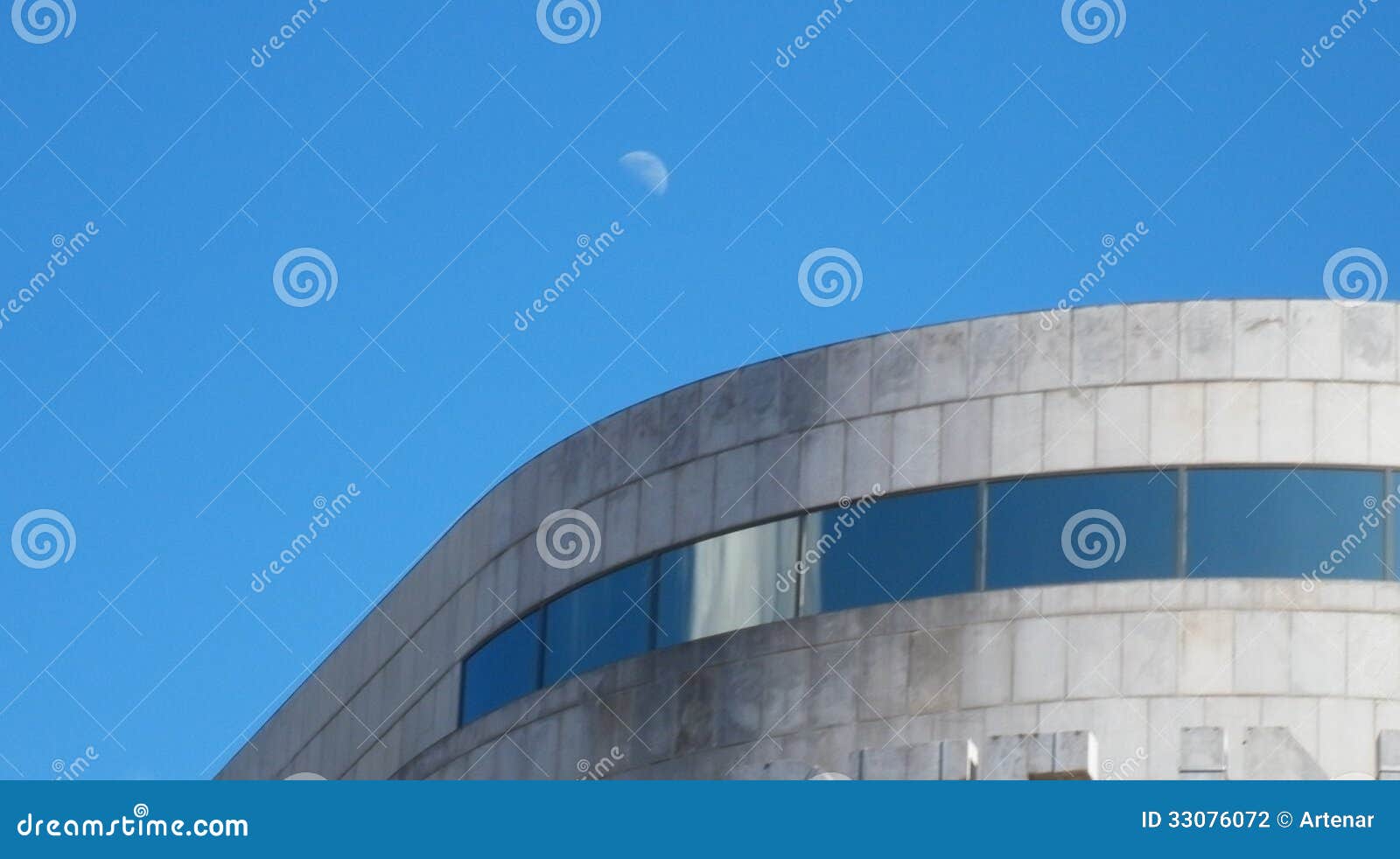 Moon over a building stock photo. Image of windows, daytime - 33076072