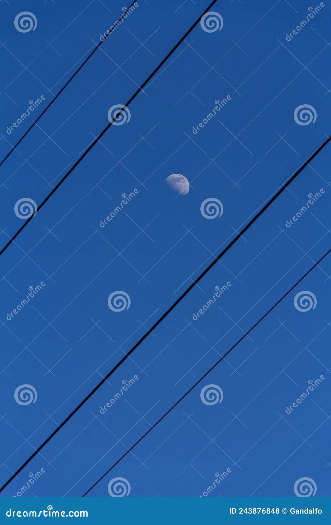 Moon between power lines stock photo. Image of moon - 243876848