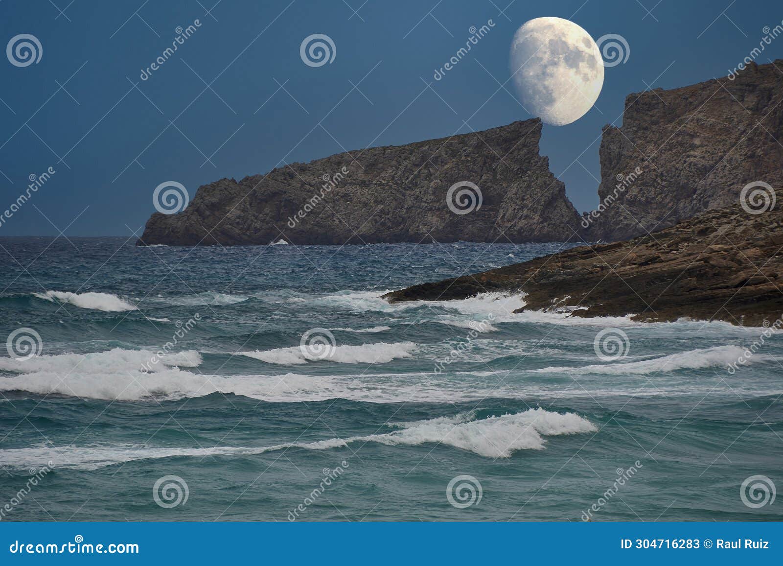 Moon Rising between the Cliffs of a Mediterranean Beach Stock Image ...