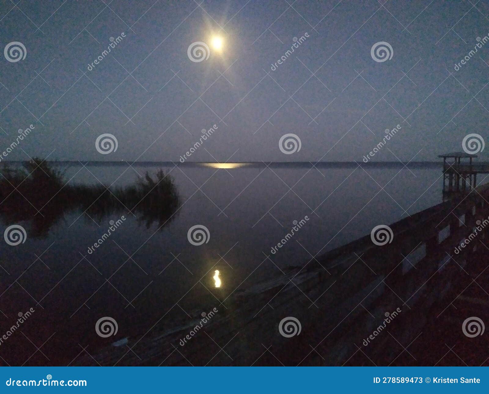 The Sun Is Setting And Dawn Is Breaking. Water Flows Through The Grass ...