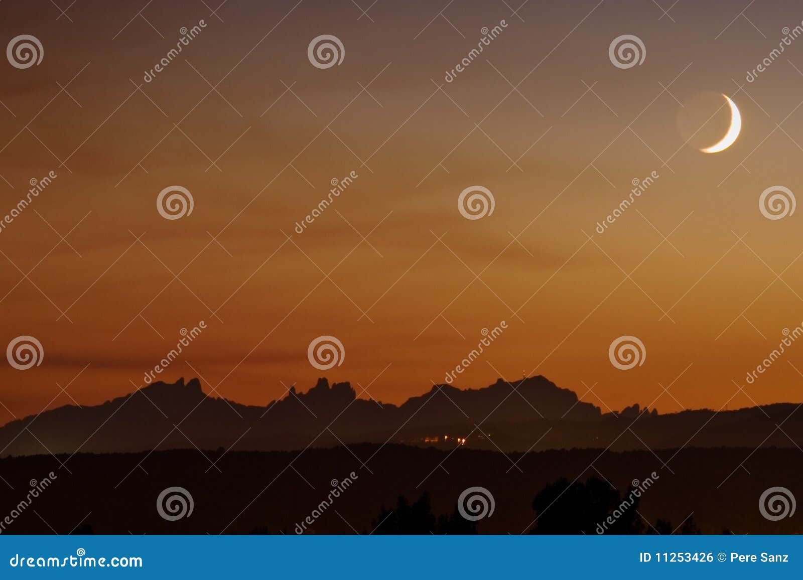 Moon Setting Over Montserrat Stock Photo - Image of sunlight, eartshine ...