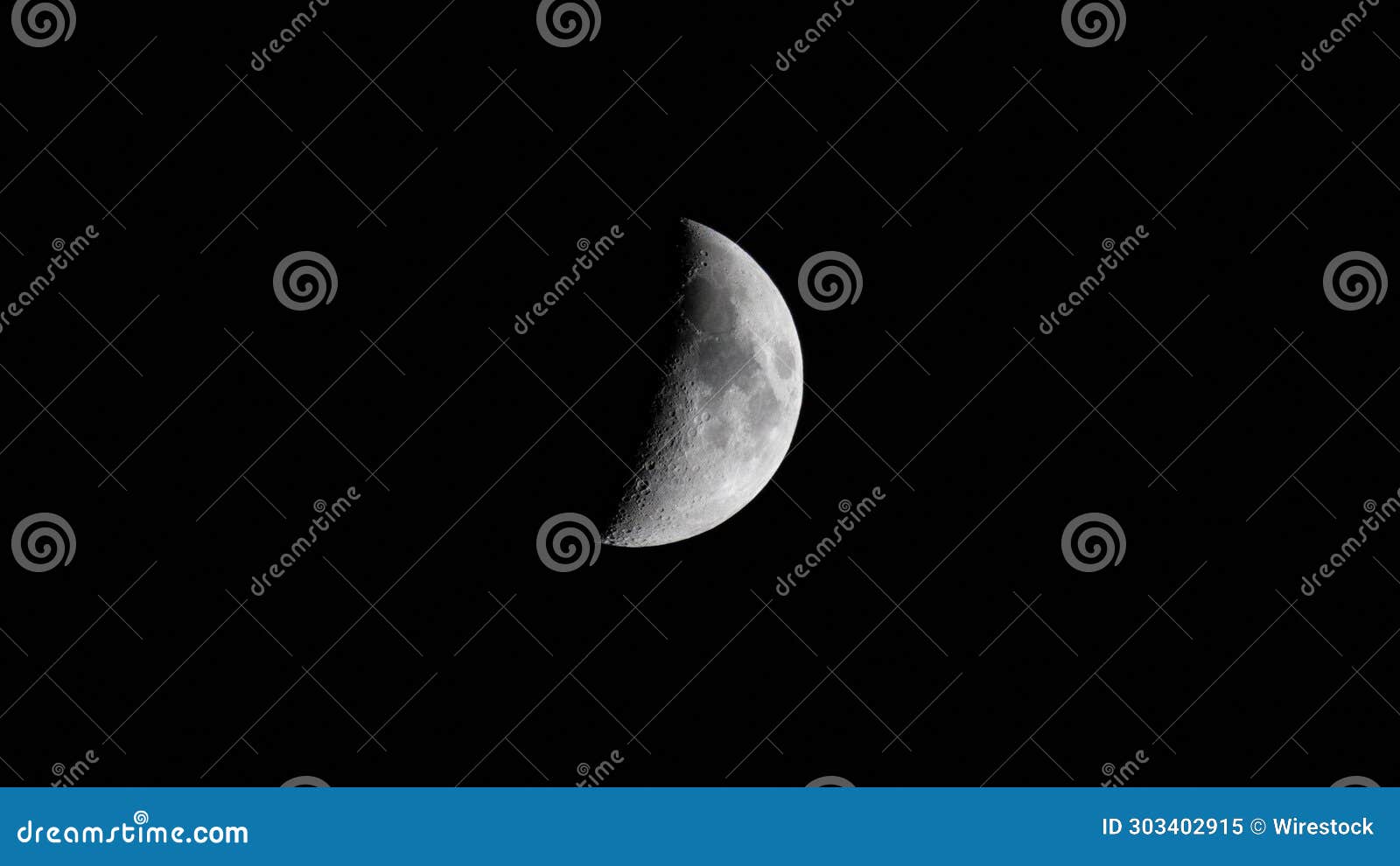 A Moon with the Shadow on it is Lit Up Against a Black Sky Stock Image ...