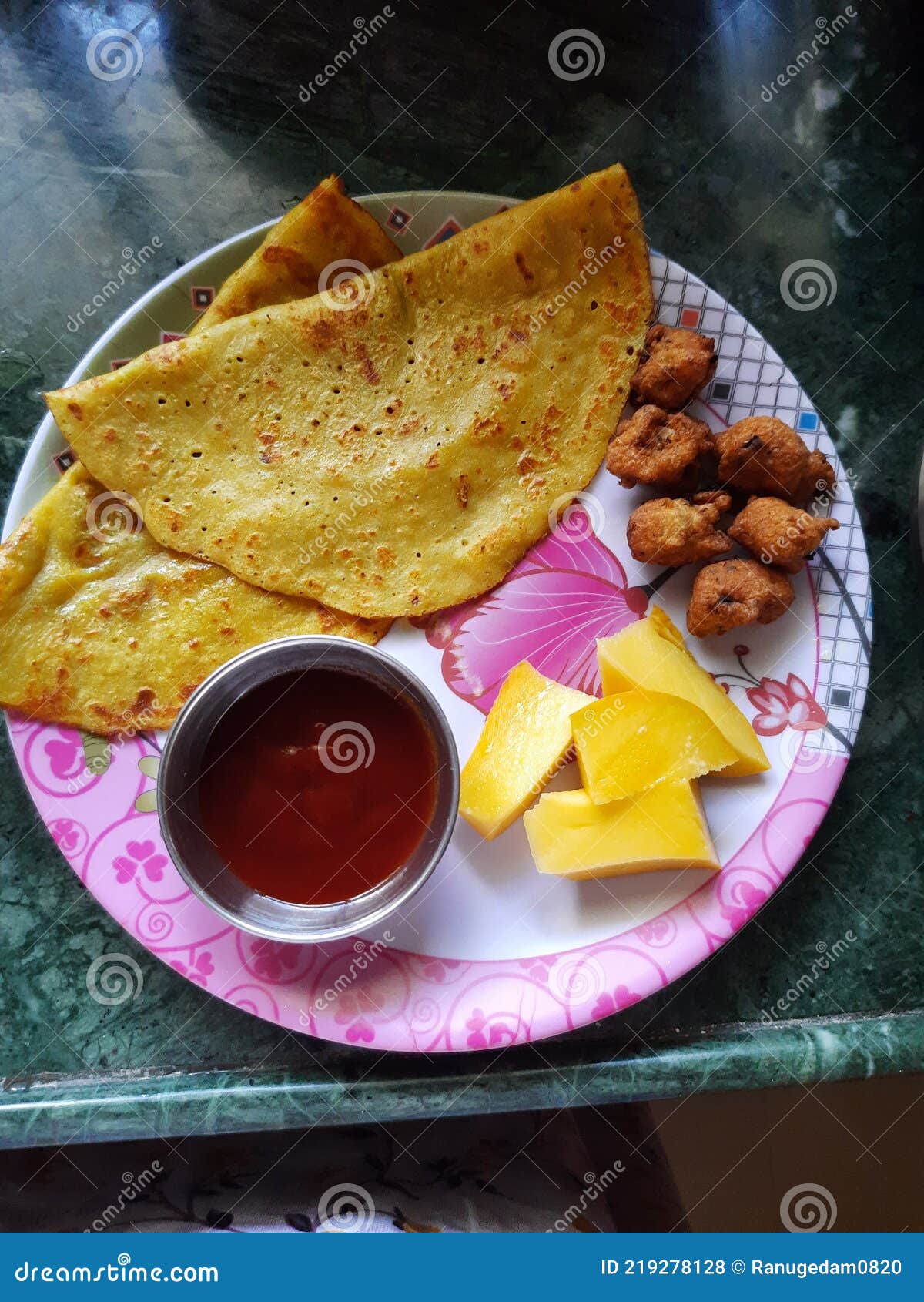 Moong Daal Chilka with Pakodey and Mangoes Stock Photo - Image of ...