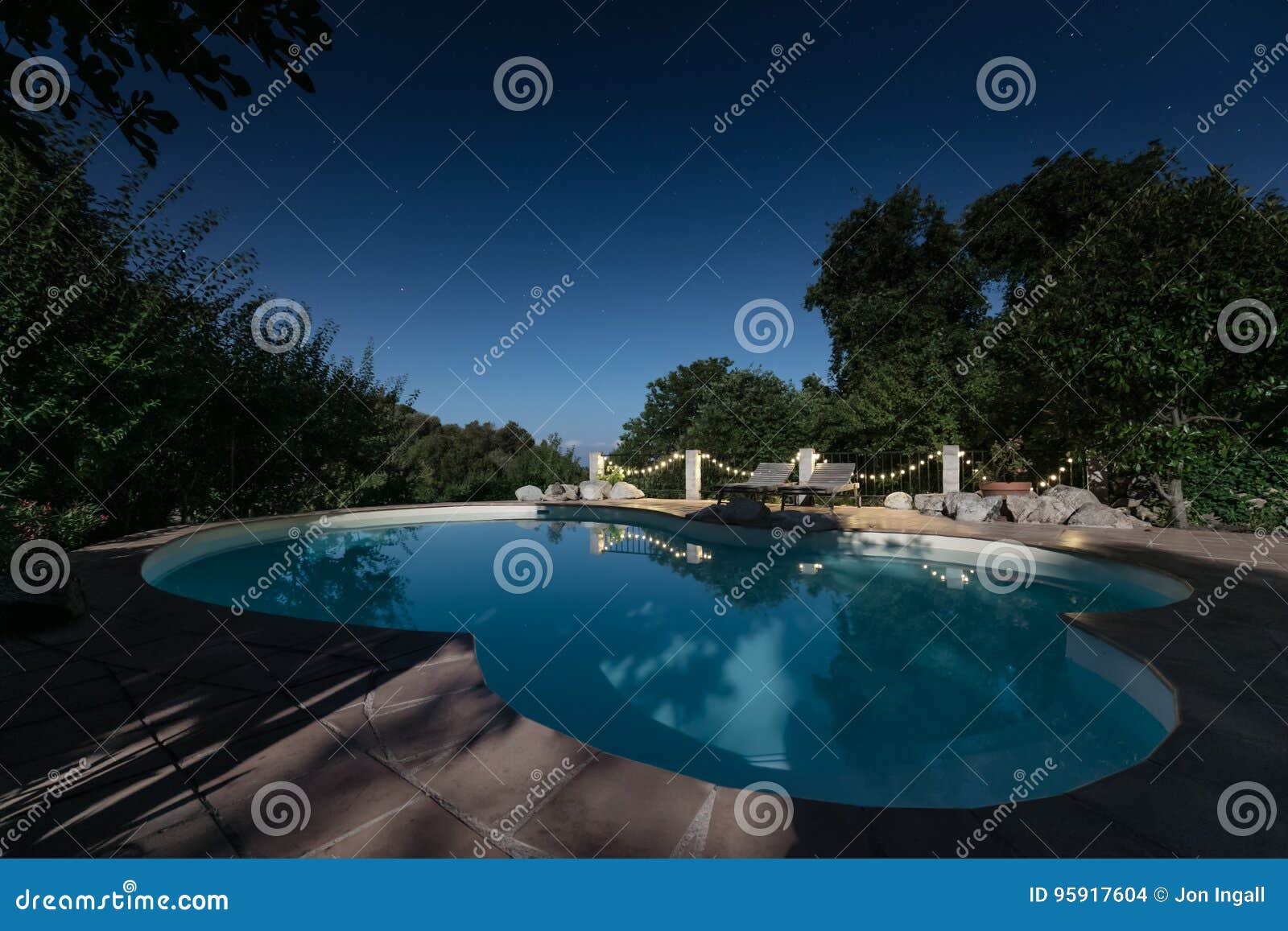 Moonlight and Night Sky Reflected on a Swimming Pool Stock Photo ...