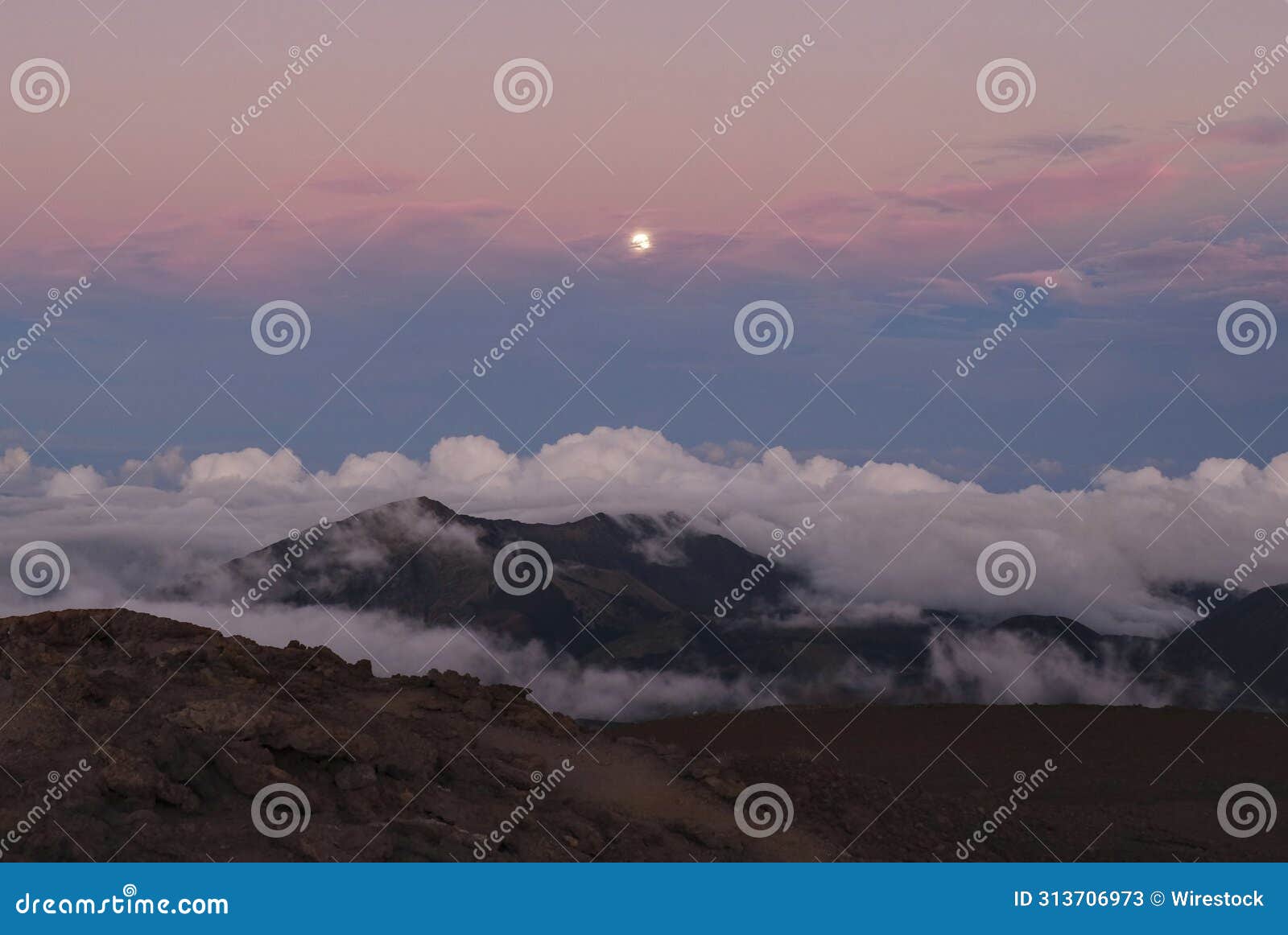 Moonrise after Sunset with Clouds Rolling Over the Mountains Stock ...