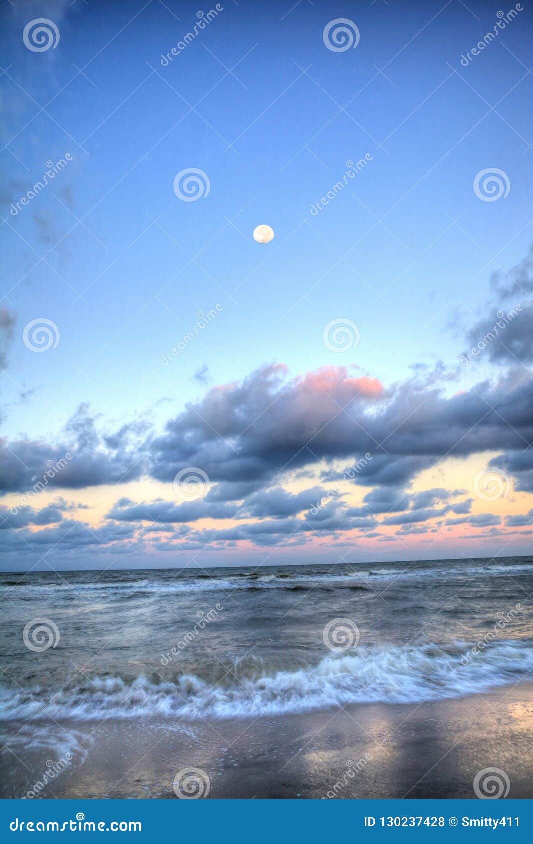 Moonset Over the Ocean at Vanderbilt Beach at Sunset Stock Photo ...