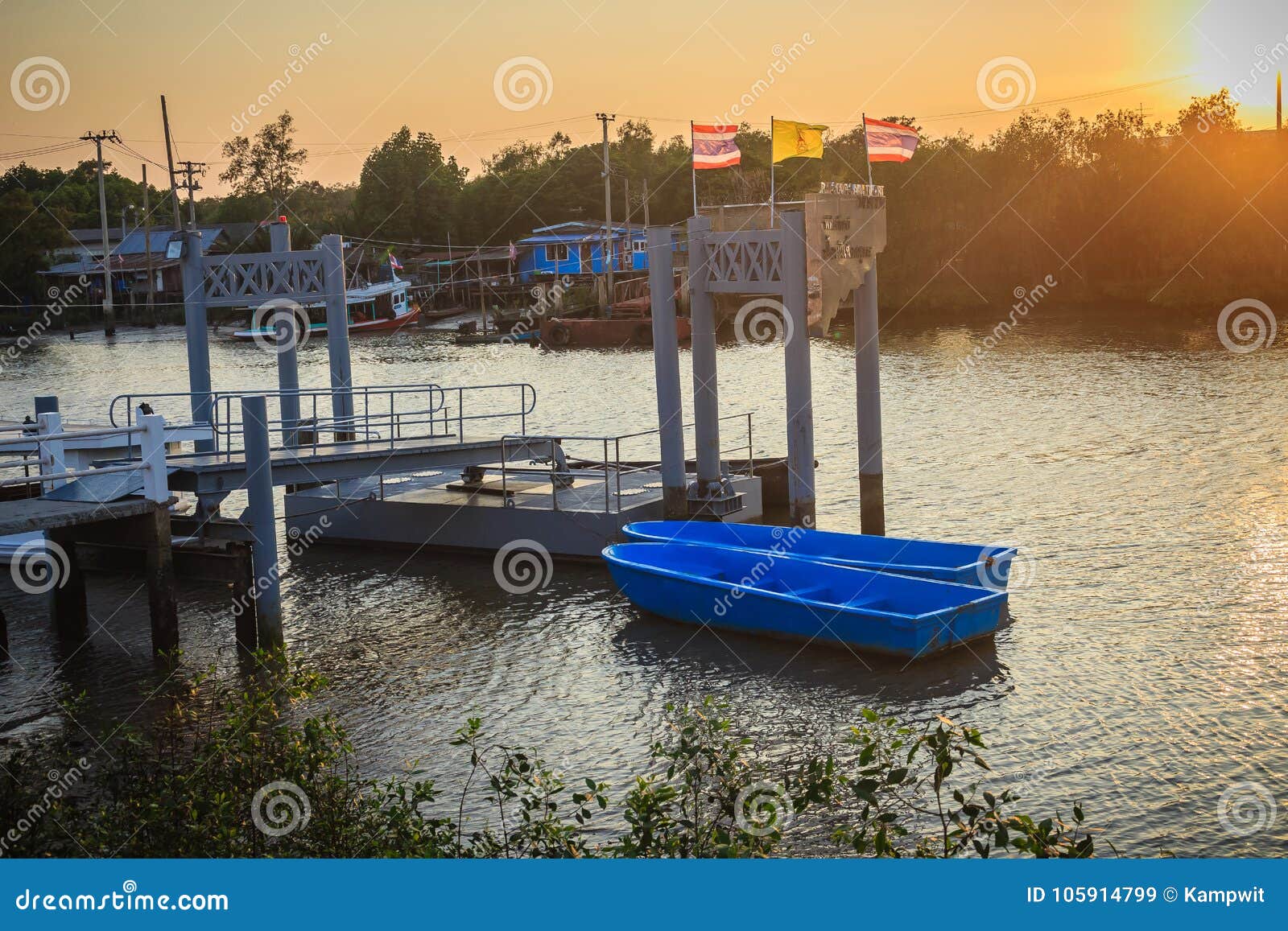Moored Blue Boats with Jetty at the Side on Canal in the Evening Stock ...