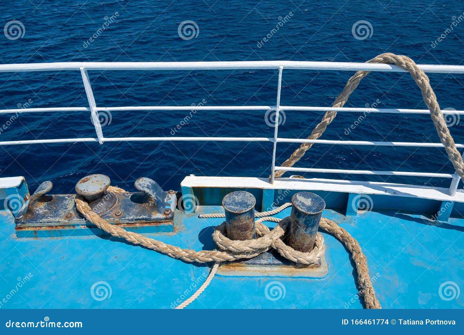 Mooring Bollards on the Deck of a Ship with a Coiled Rope Against the ...