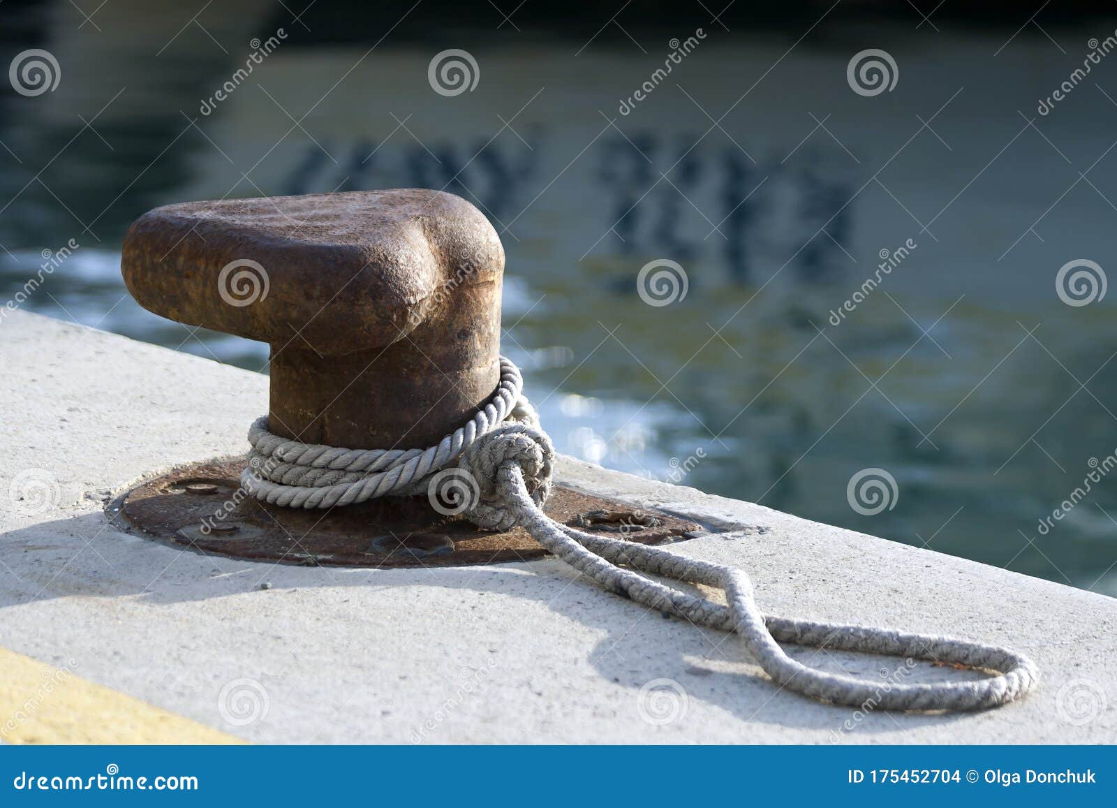 Mooring post at sea harbor stock photo. Image of rope - 175452704