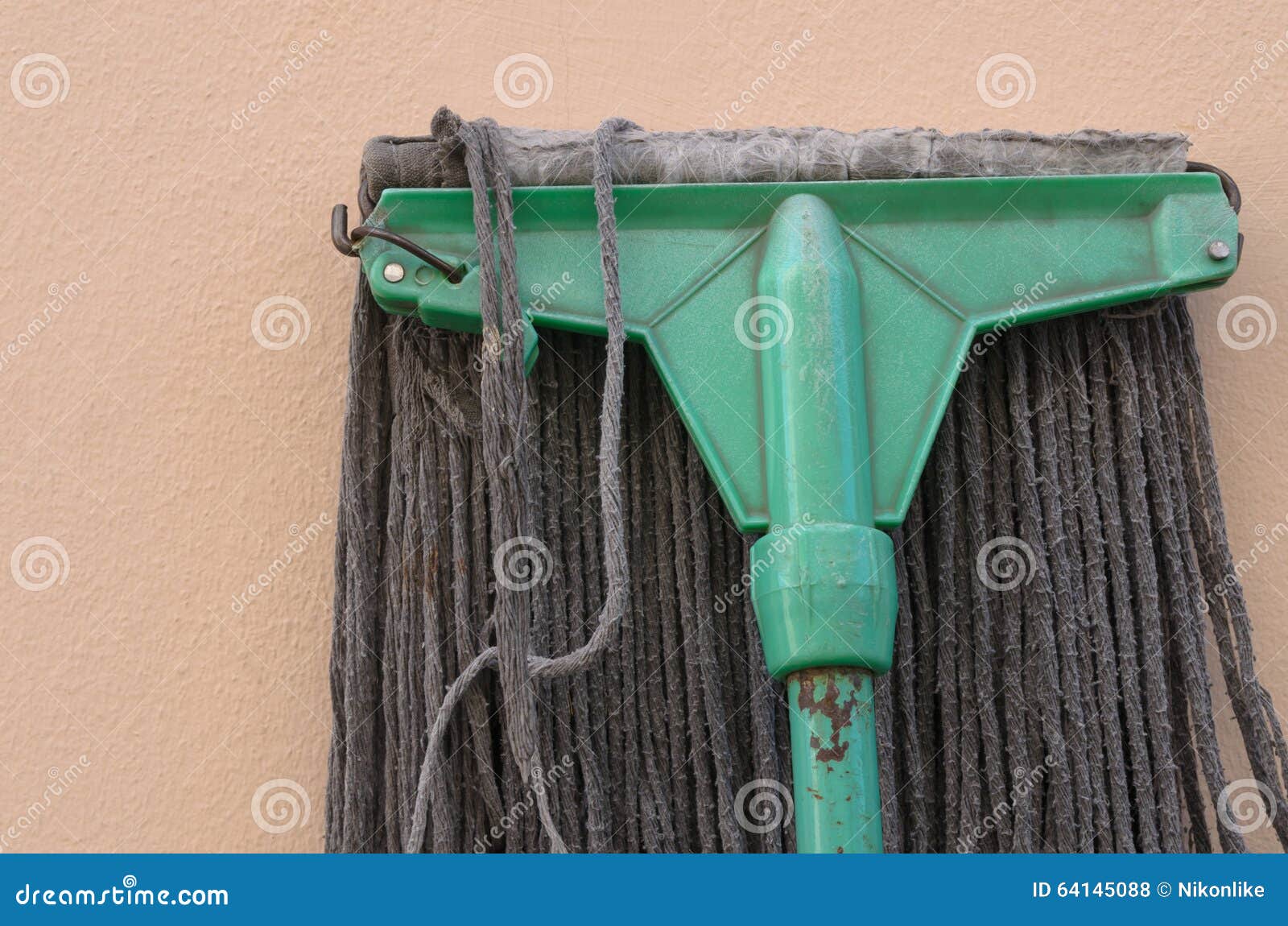 A Mop Lying Against a Wall. Stock Photo - Image of tool, cleaning: 64145088