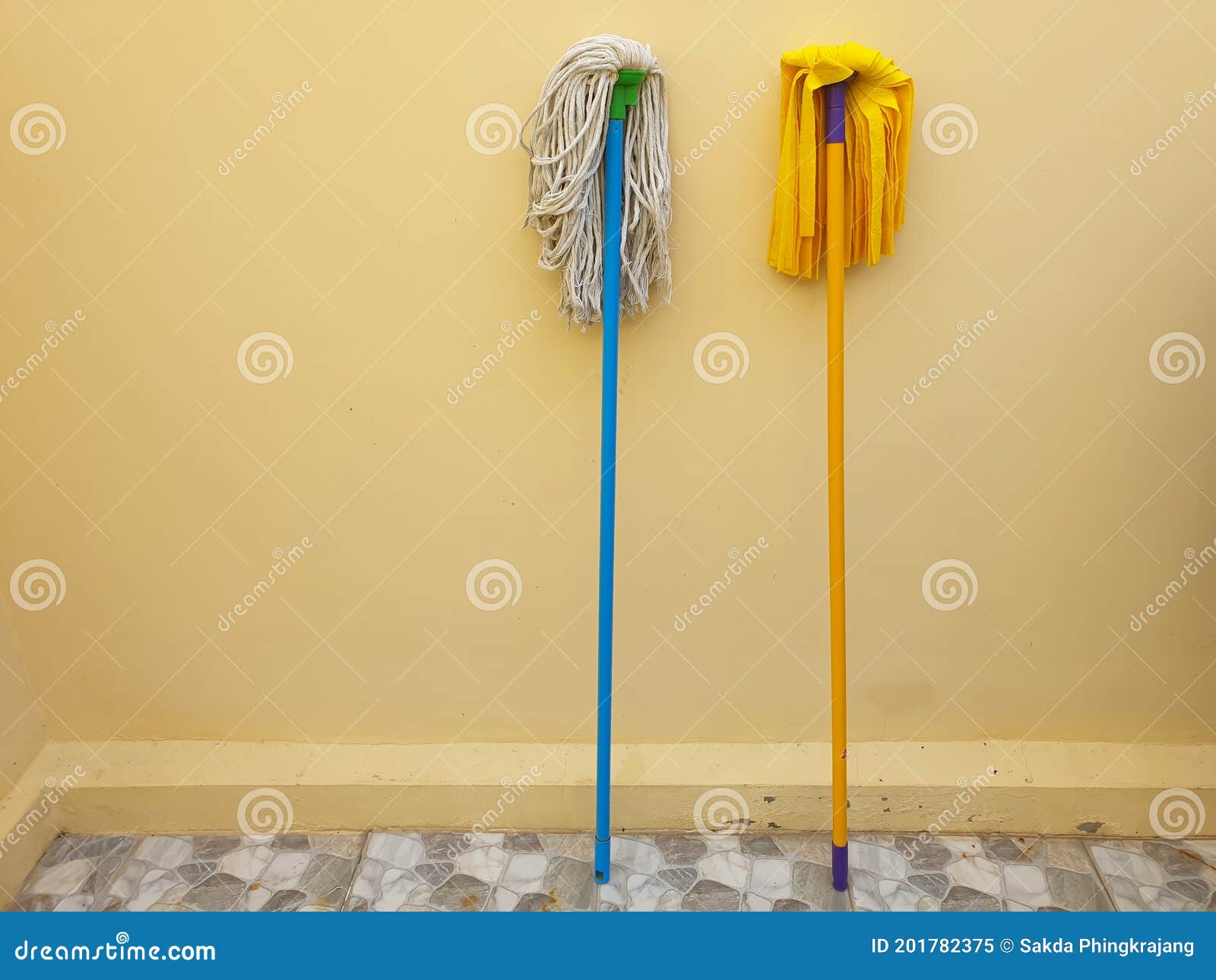 2 mops, yellow and blue, stock image. Image of concept - 201782375
