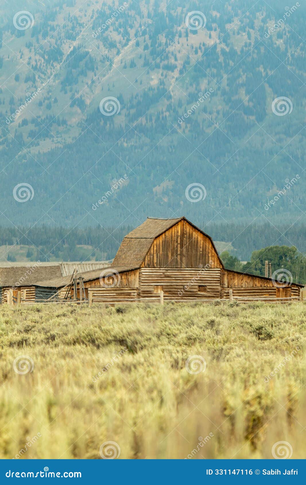 A Mormon Row Barn Against the Grand Teton Mountain Range Stock Photo ...