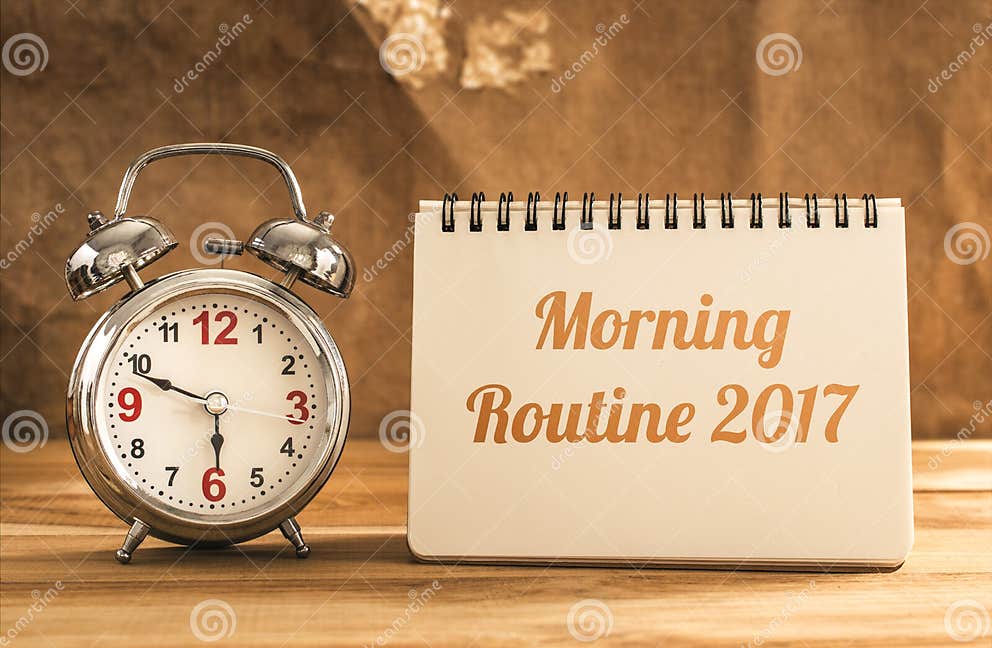 Morning Routine 2017 Text on Notebook with Alarm Clock on Wood T Stock ...