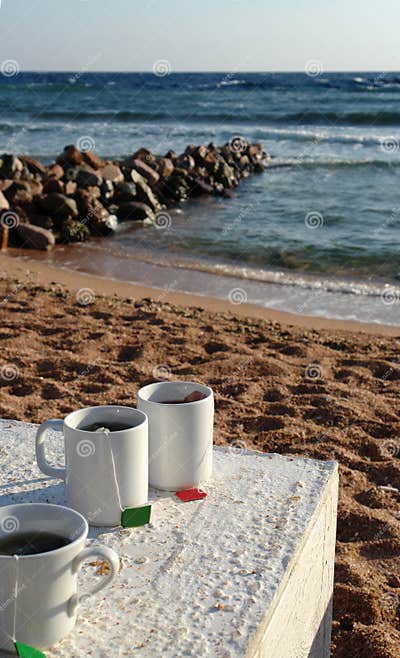 Morning tea on a beach stock image. Image of relaxation - 9583457