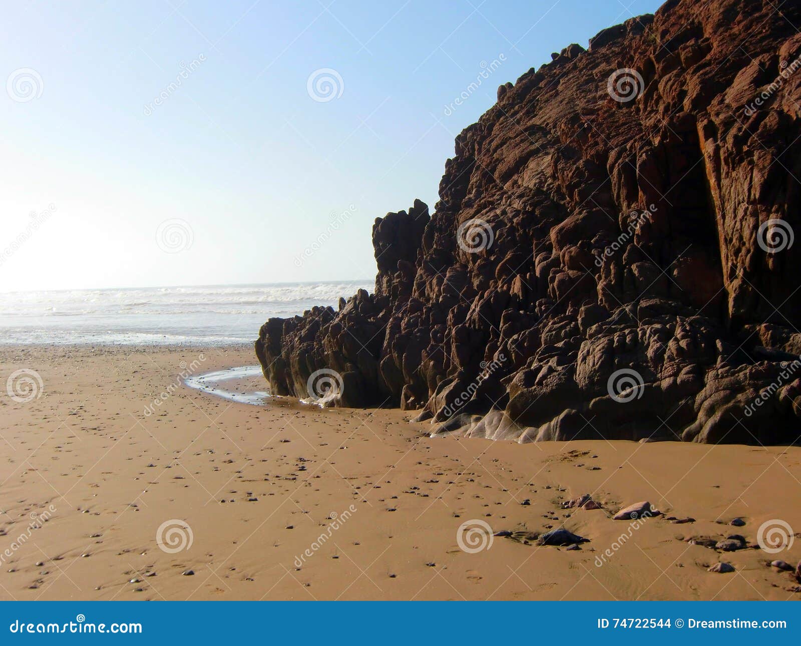 Moroccan beach with a rock stock photo. Image of cloudless - 74722544