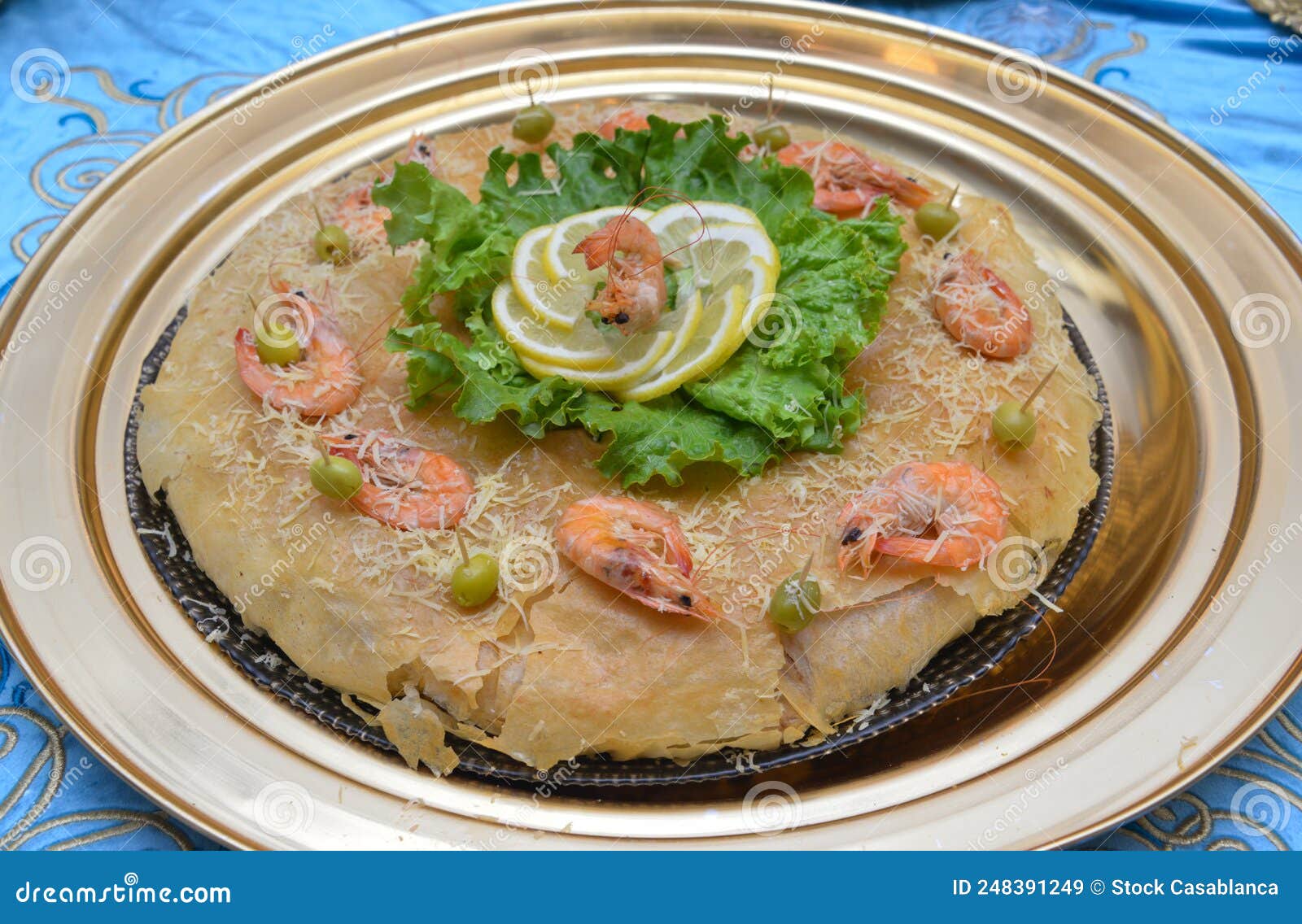 Moroccan Fish Pie Called Bastilla in Morocco, Decorated with Shrimps ...