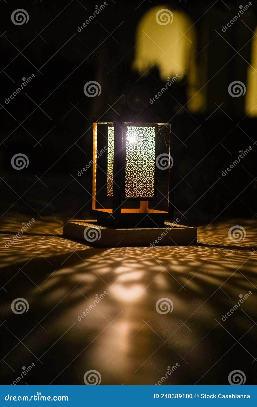 Moroccan Lamp Illuminating Different Colored Patterns of Light on Wall ...