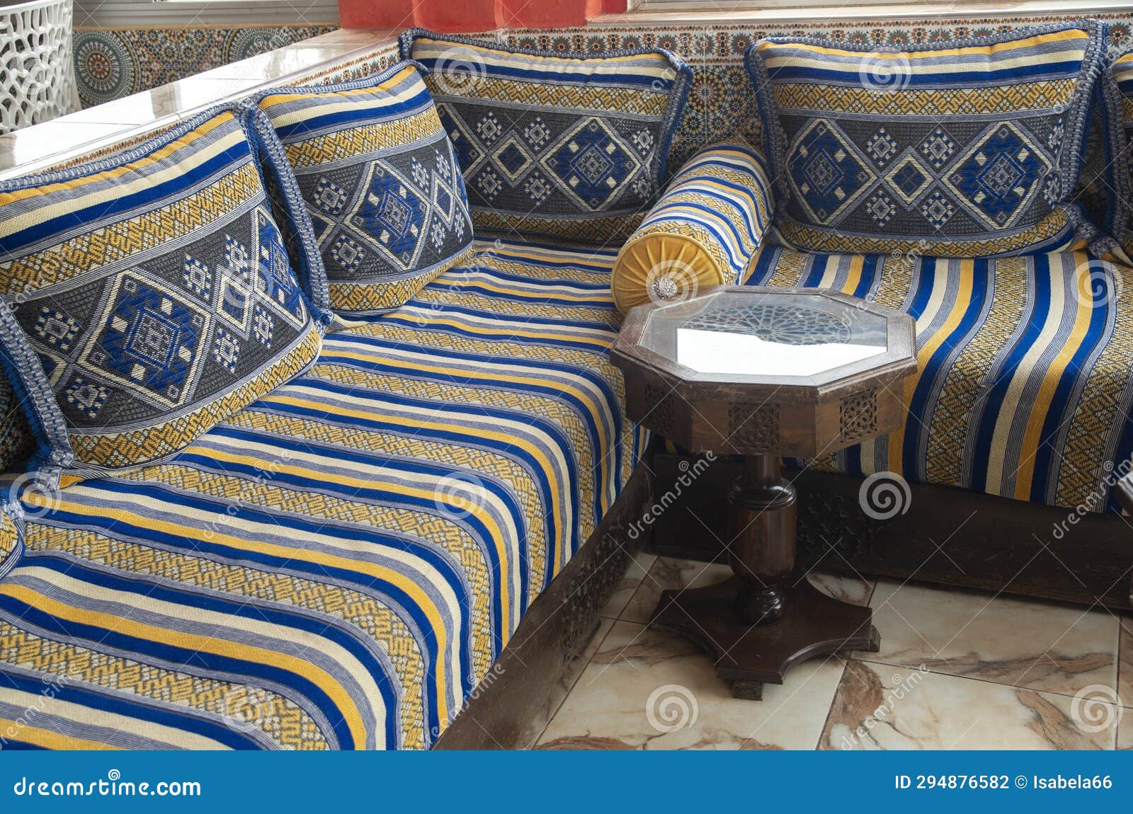 Moroccan Sofa with Cushions and Small Ornate Wooden Table Stock Photo ...