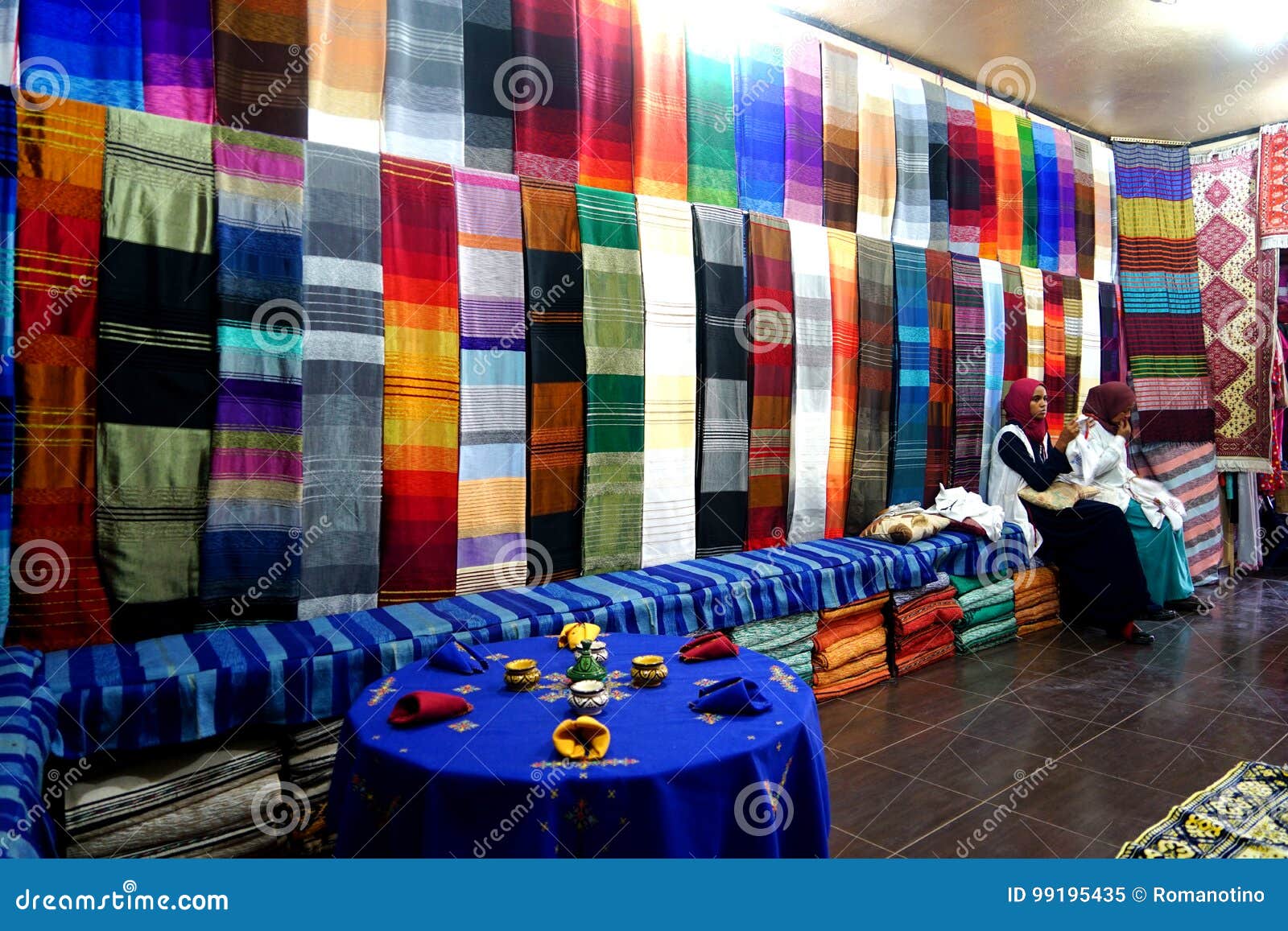 Two Berber Women are Working in Colorful Souk Fabrics in Morocco ...